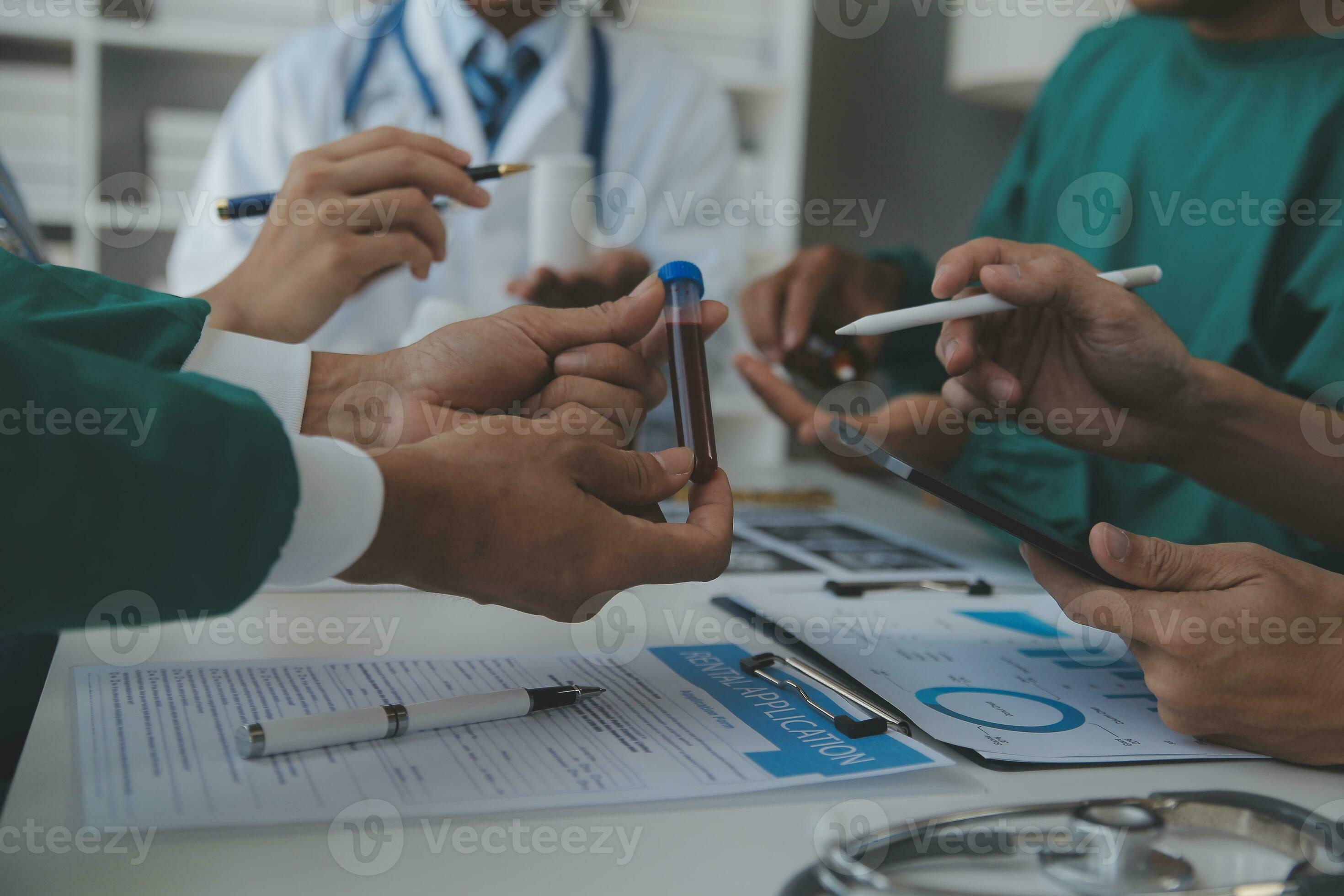 Cropped image of successful medical doctors discussing diagnosis during ... Cropped image of successful medical doctors discussing diagnosis during ...