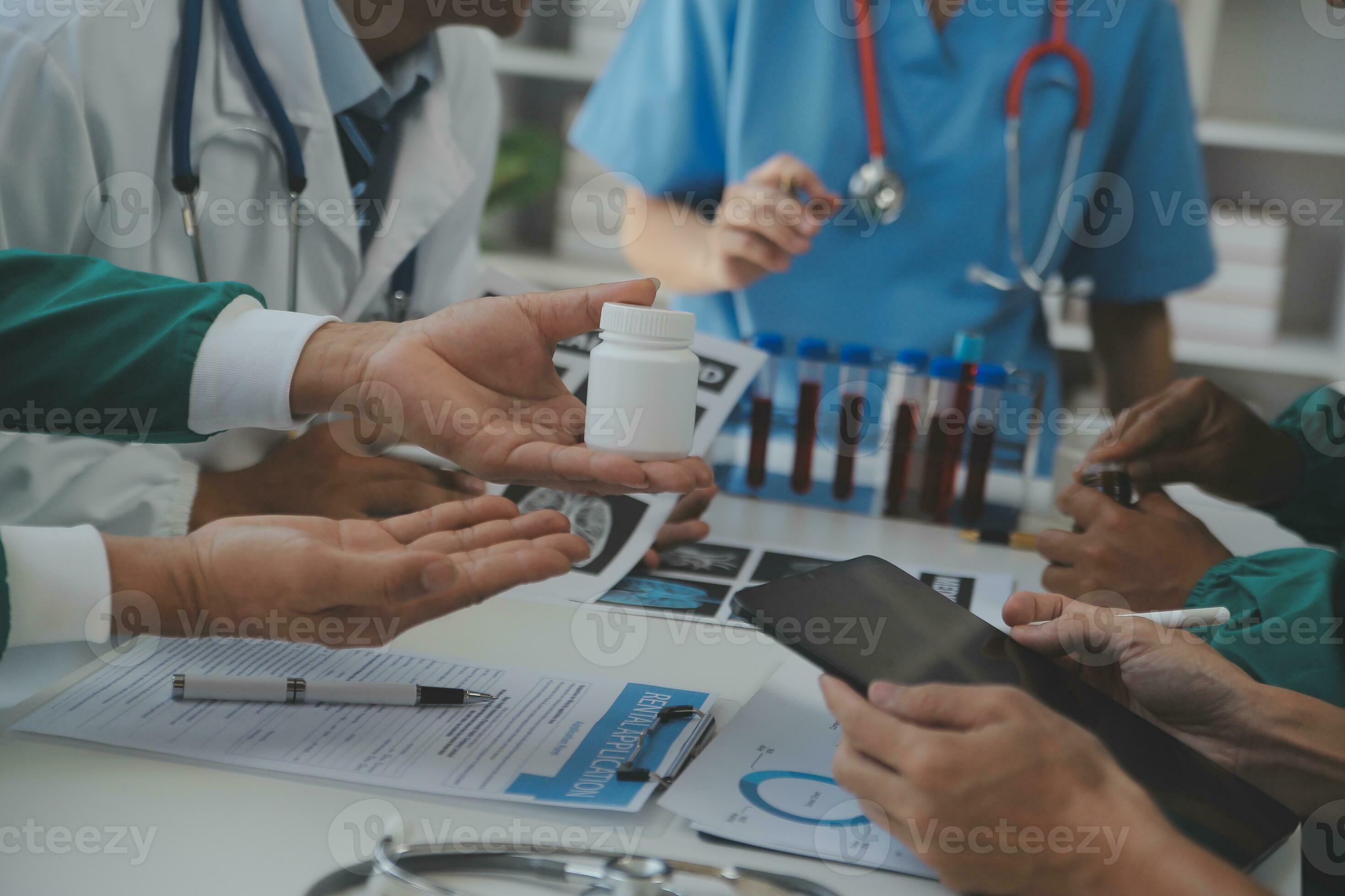 Cropped image of successful medical doctors discussing diagnosis during ... Cropped image of successful medical doctors discussing diagnosis during ...