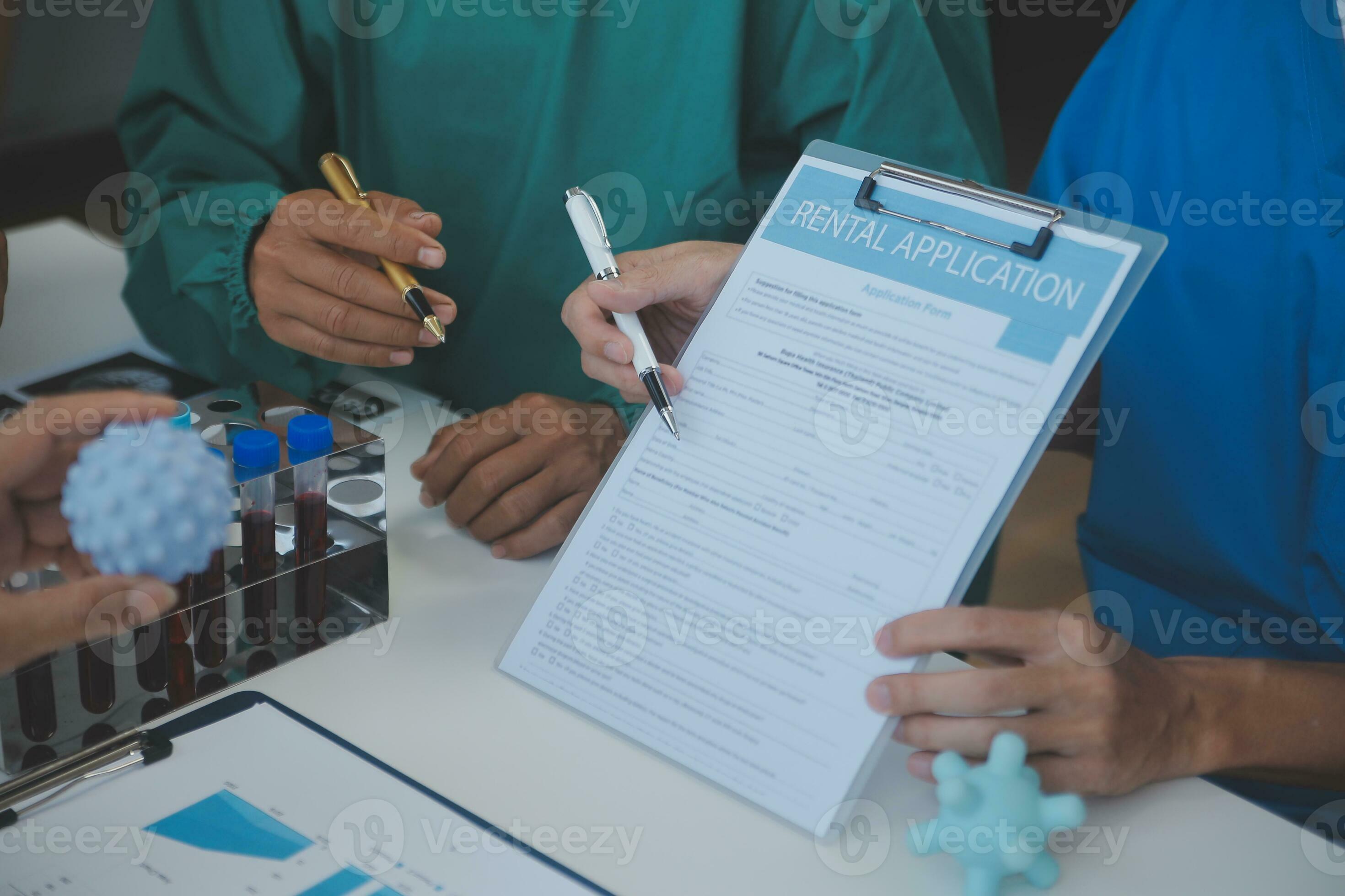 Cropped image of successful medical doctors discussing diagnosis during ... Cropped image of successful medical doctors discussing diagnosis during ...