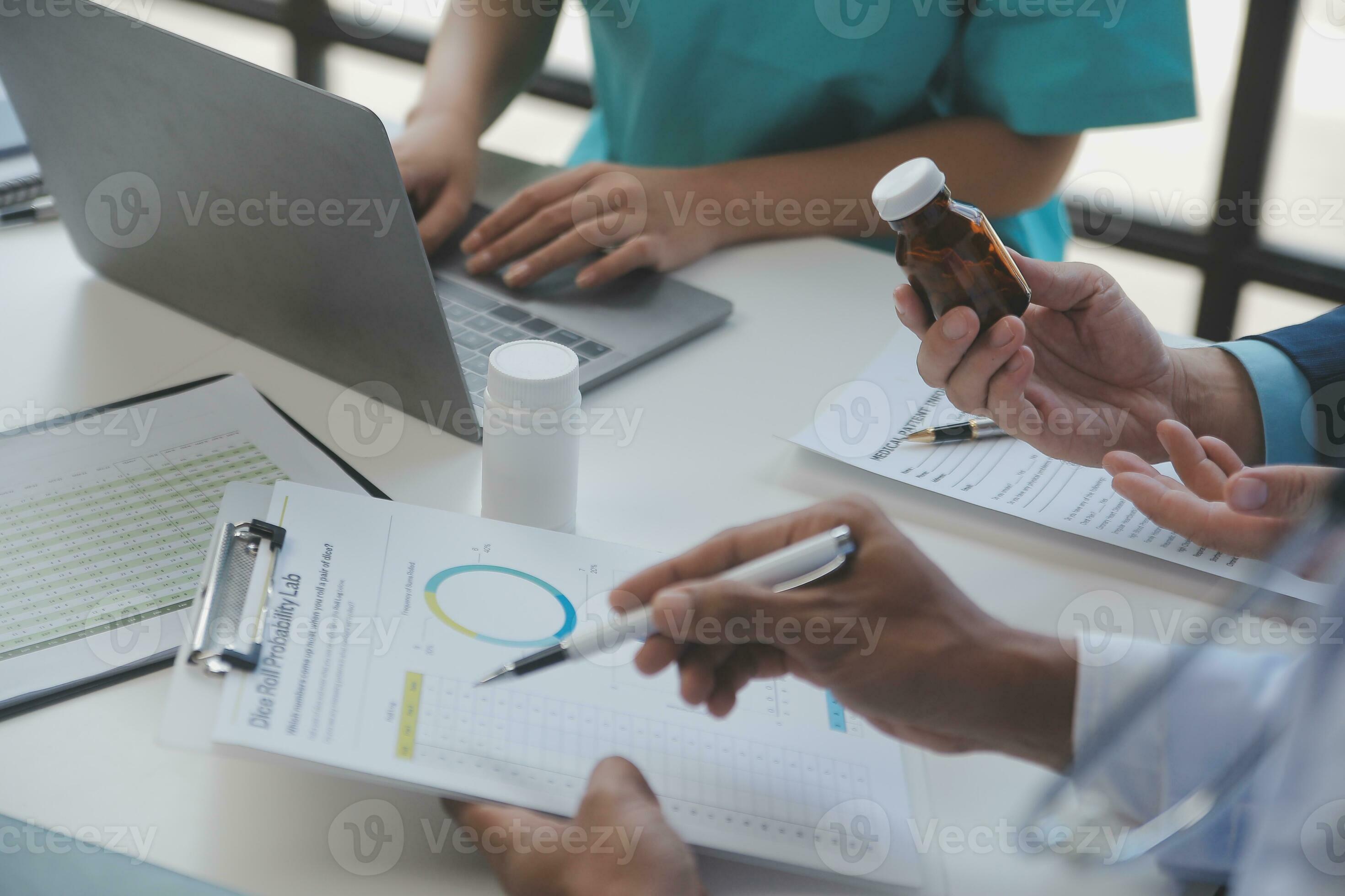 Cropped image of successful medical doctors discussing diagnosis during ... Cropped image of successful medical doctors discussing diagnosis during ...