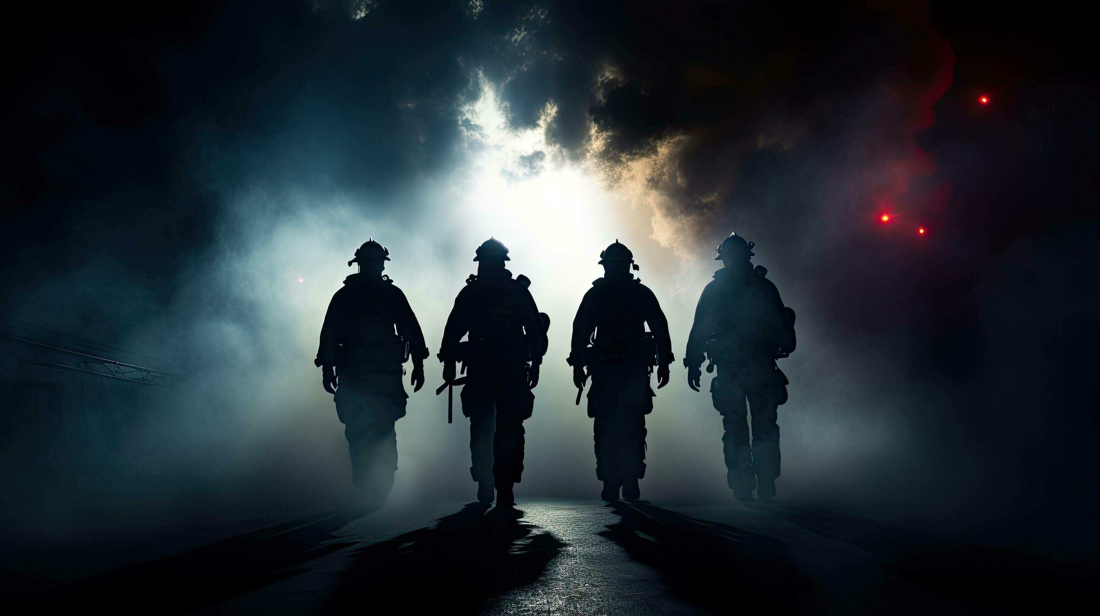 Firefighters with flashlights on their chests walking away from smoke ...