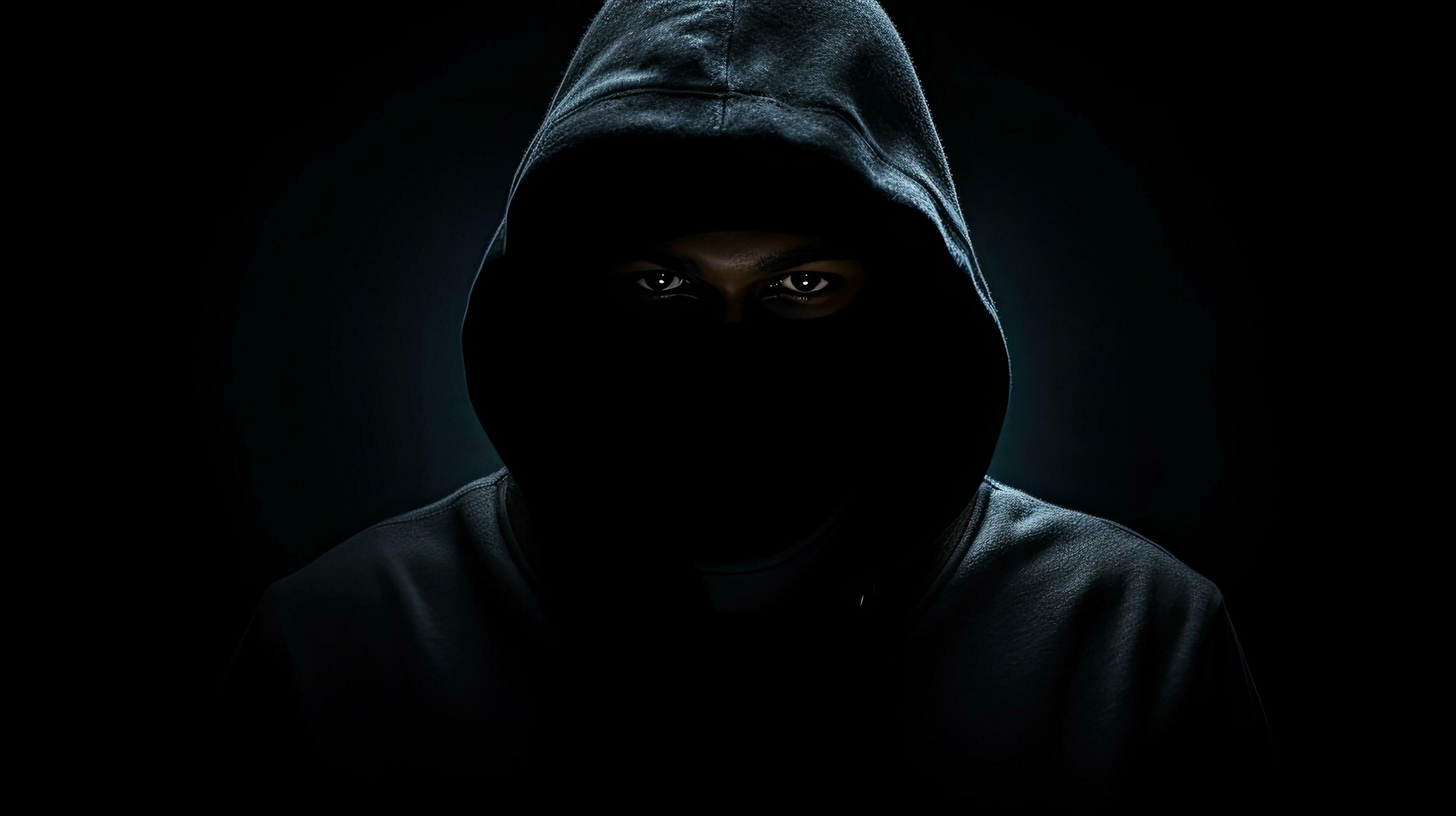 Silent figure in hood on dark backdrop concealed face symbolizing criminality mystery secrecy ...