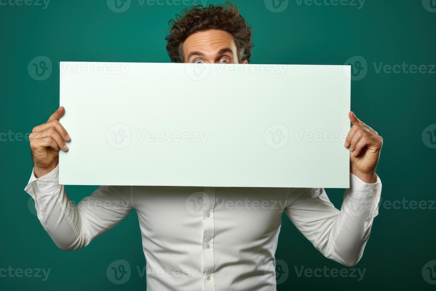 Handsome man with empty blank paper on minimalist background. 27121607 ...