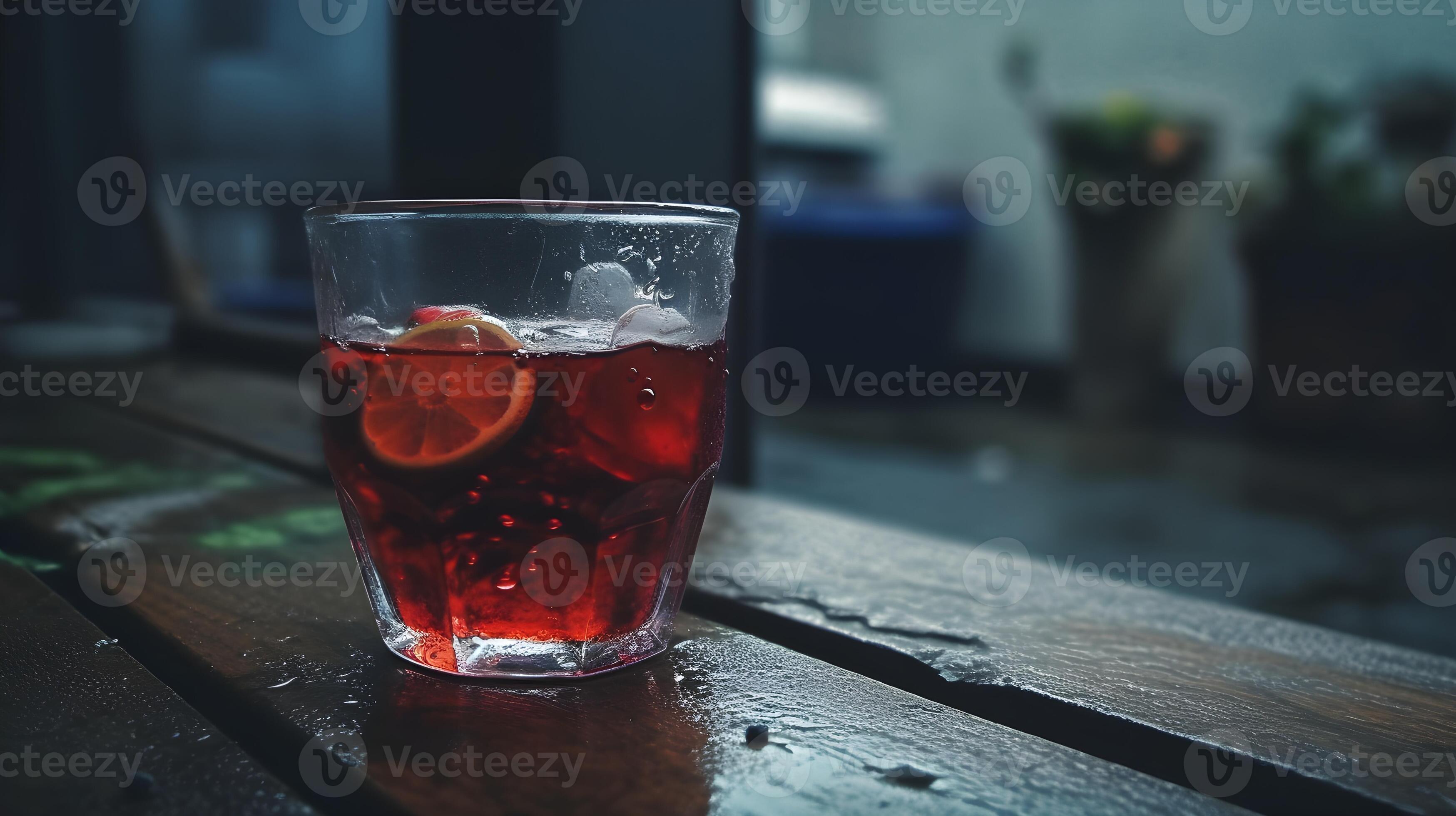 Refreshing Red Beverage drink in glass, focus on foreground, indoor table. 27122853 Stock Photo ...