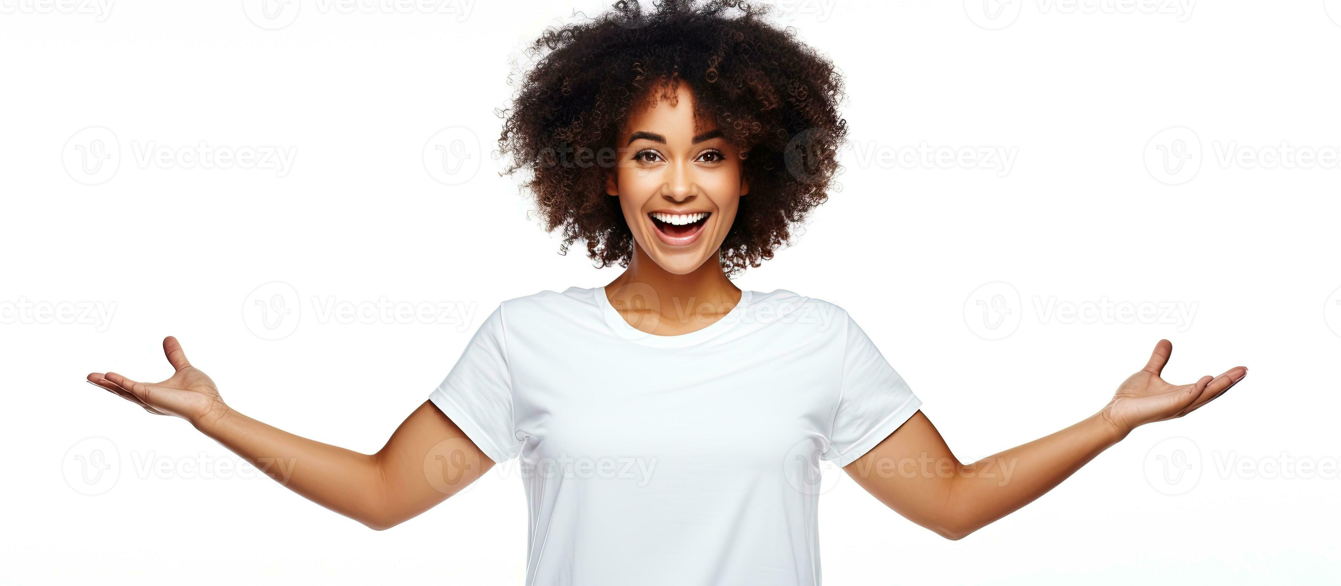 African American woman in t shirt pointing with open hands smiling excitedly with copy space ...