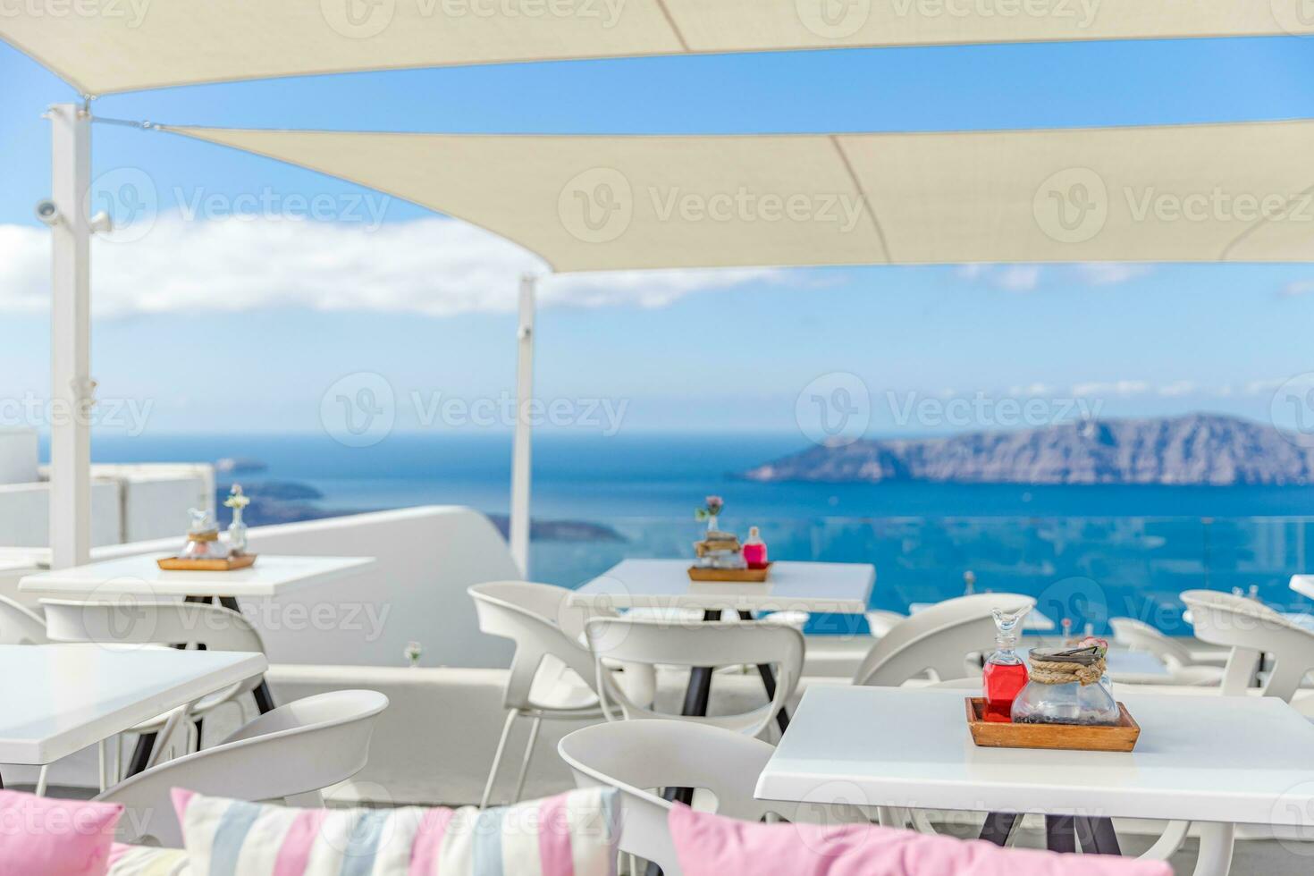 Cafe on the terrace overlooking the sea. Santorini island, Greece ... Cafe on the terrace overlooking the sea. Santorini island, Greece ...