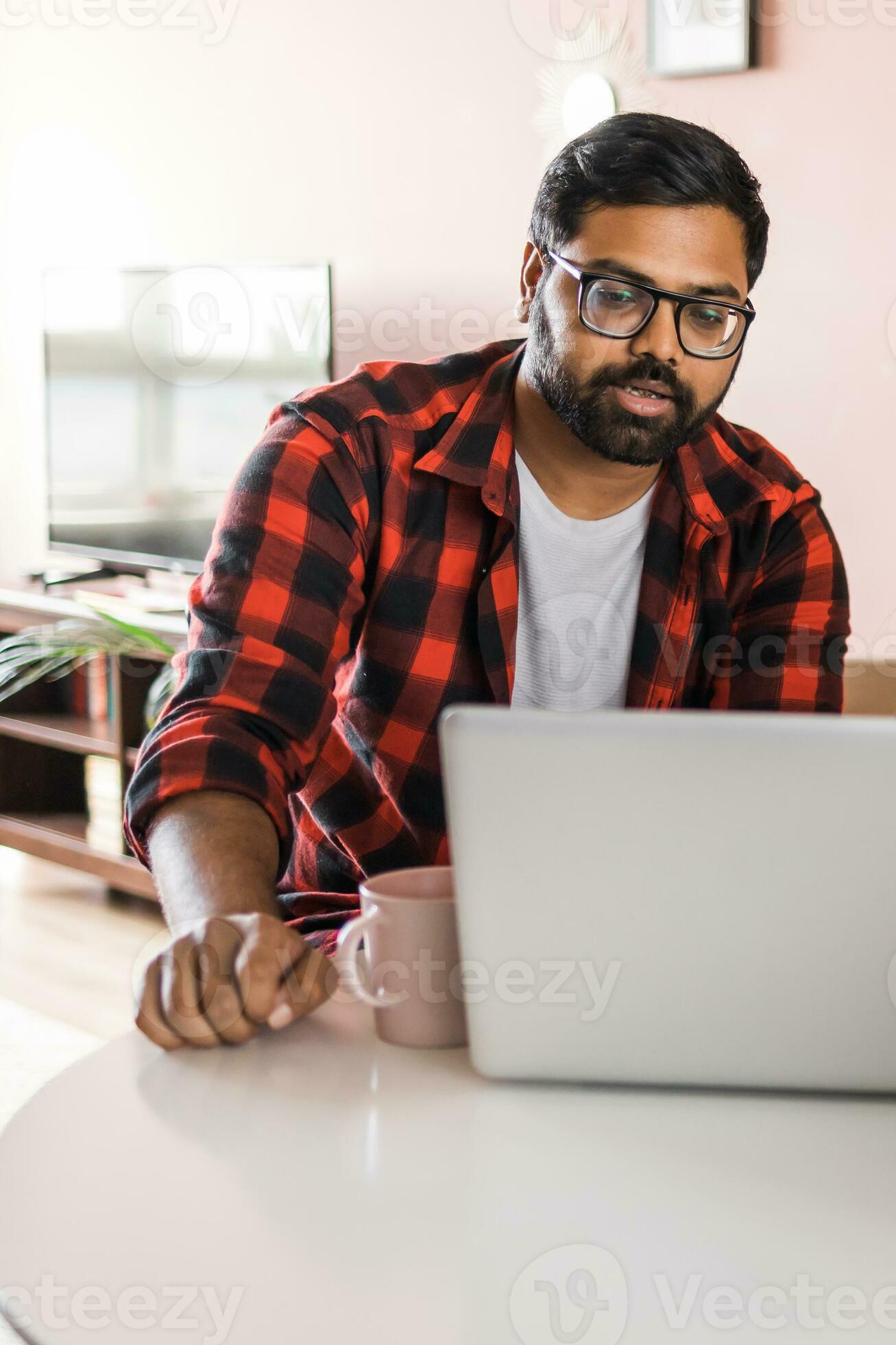 technology remote job and lifestyle concept - happy indian man in ...