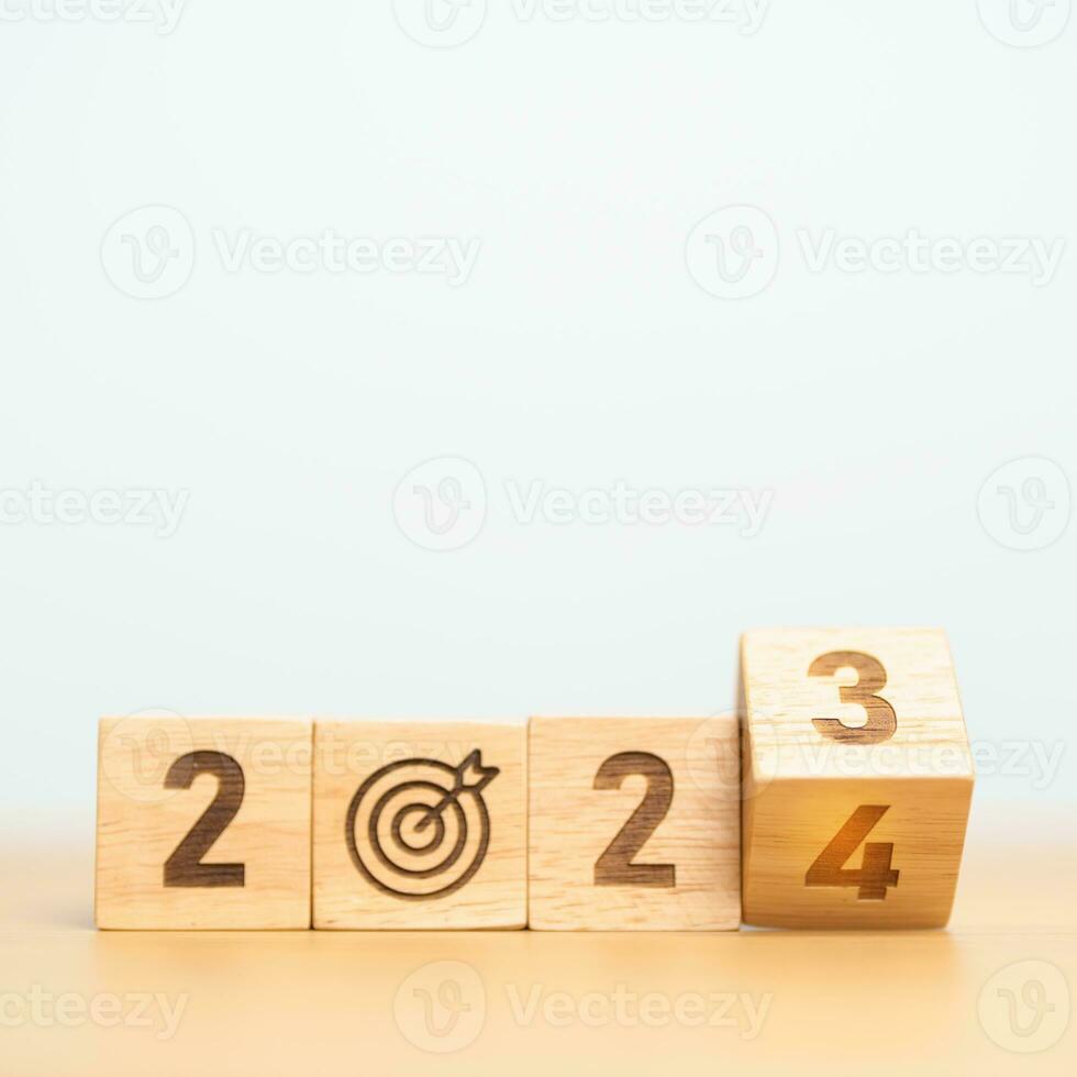 2023 year change to 2024 year block with dartboard icon. Goal, Target, Resolution, strategy ...