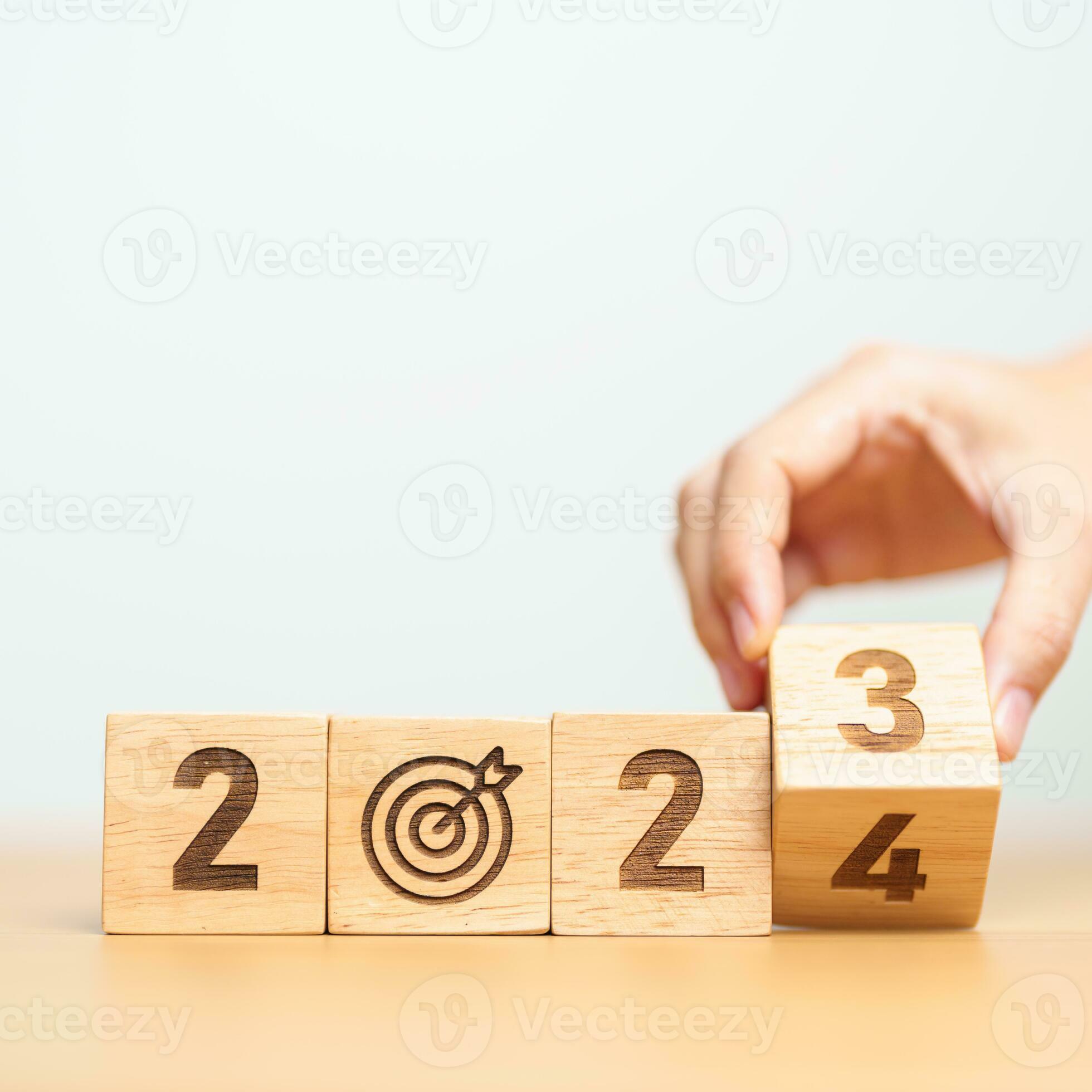 2023 year change to 2024 year block with dartboard icon. Goal, Target, Resolution, strategy ...