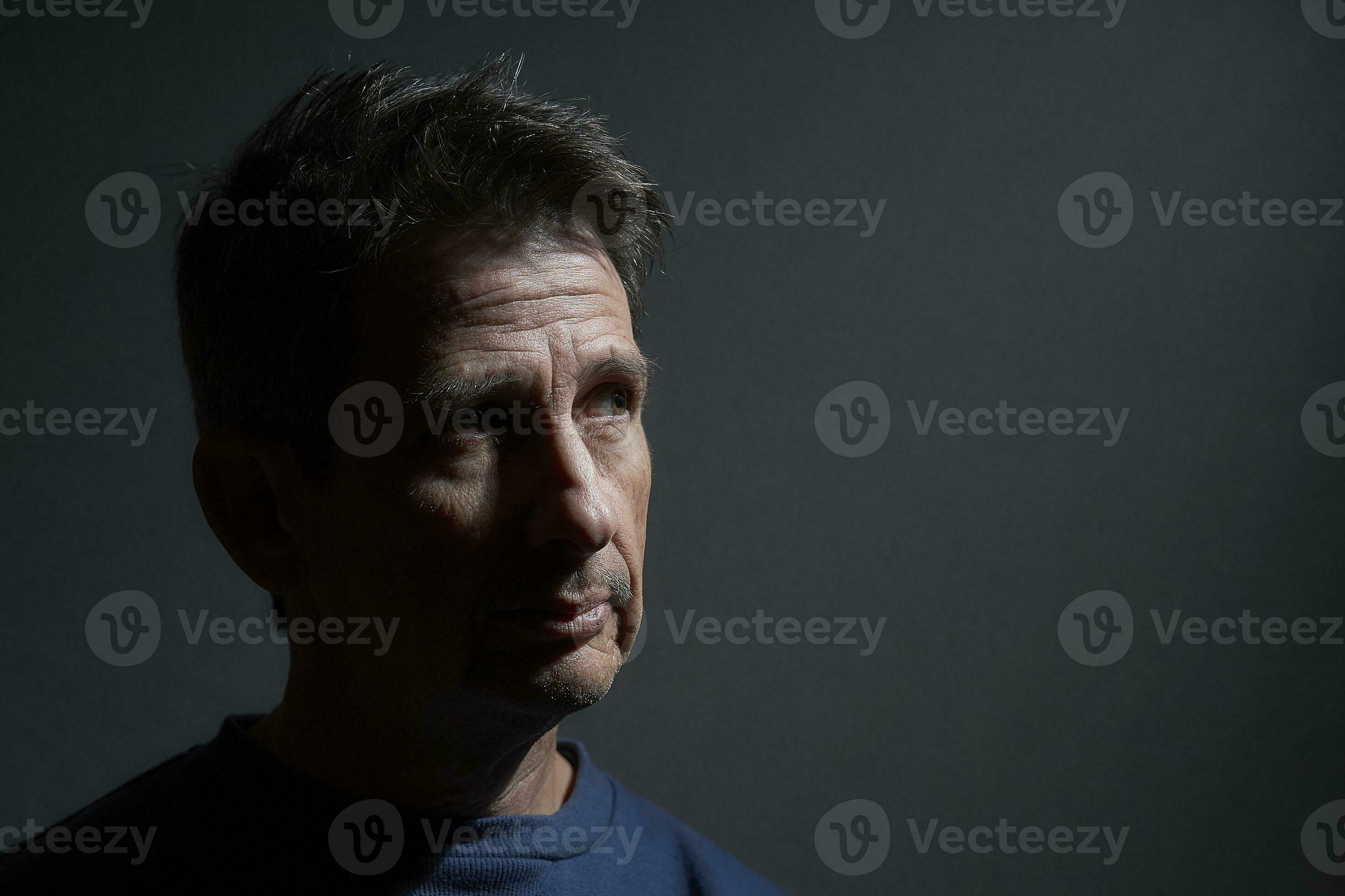 A 50-Year-Old White Man Leaning Against the Wall with a Pensive Expression 27479438 Stock Photo ...