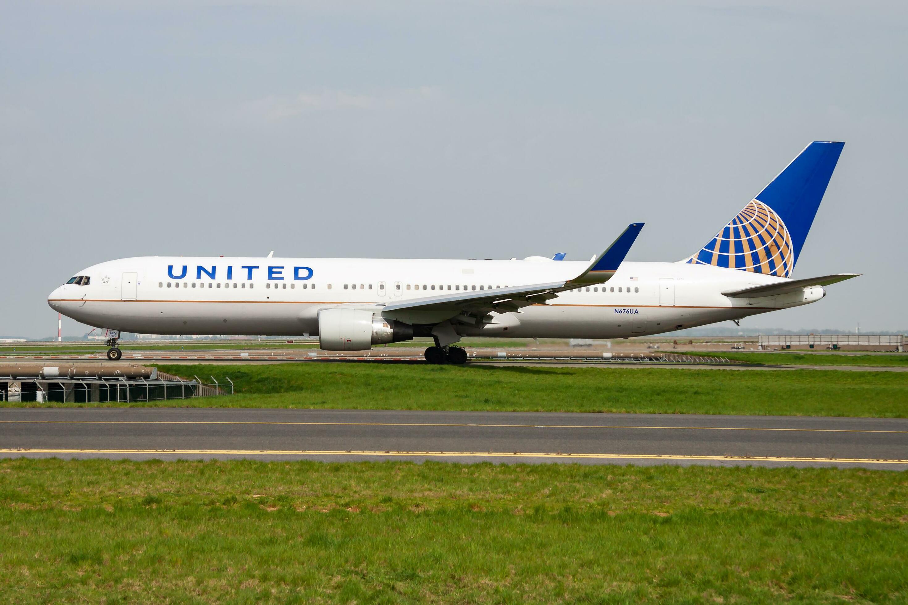 United Airlines Boeing 767-300ER N676UA passenger plane departure and take off at Paris Charles ...