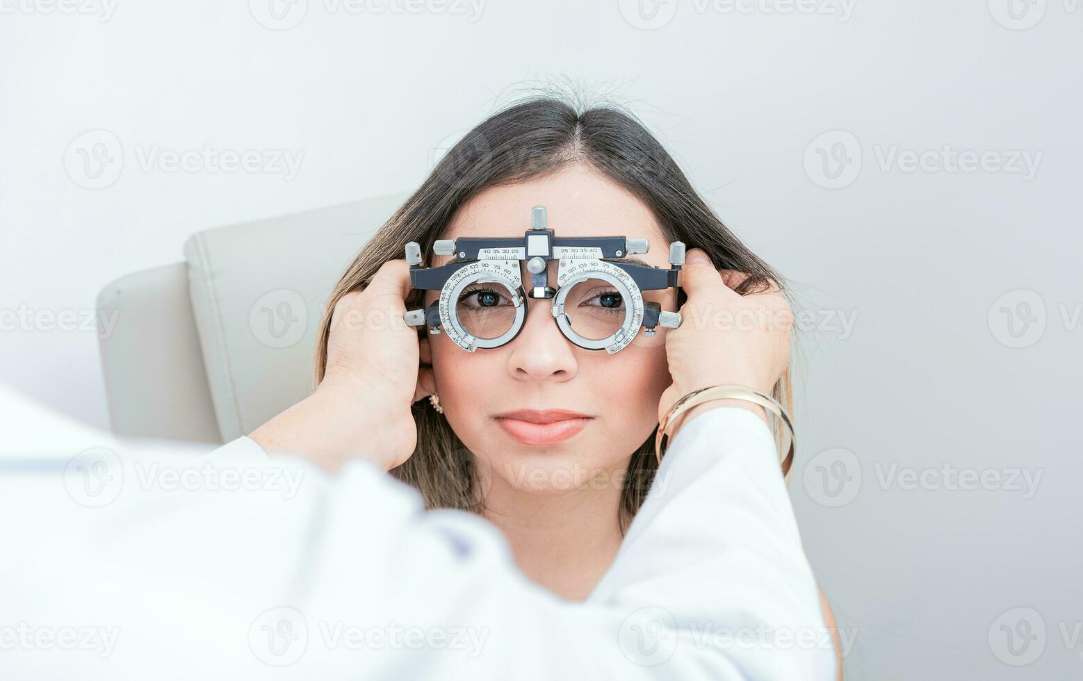 Ophthalmologist examining patient with optometrist trial frame. Doctor ... Ophthalmologist examining patient with optometrist trial frame. Doctor ...