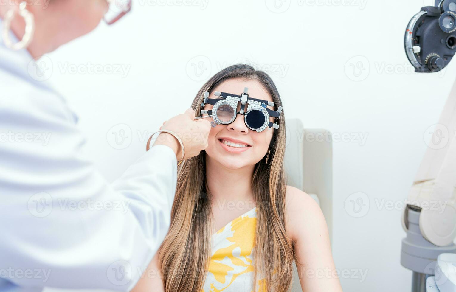 Smiling patient with optometrist trial frame. Closeup of optometrist ... Smiling patient with optometrist trial frame. Closeup of optometrist ...