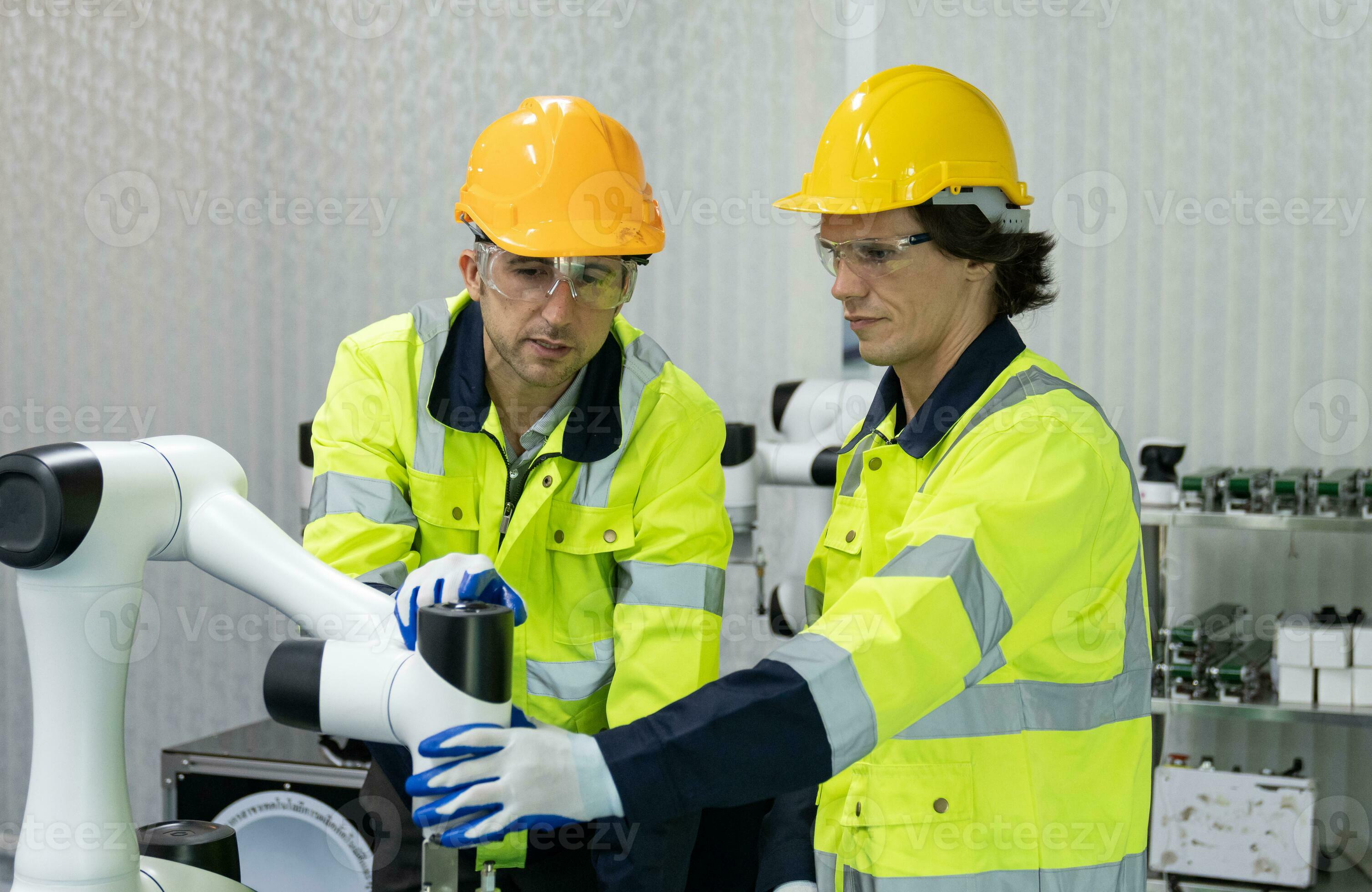 Two male automation machine engineer students studying training ...