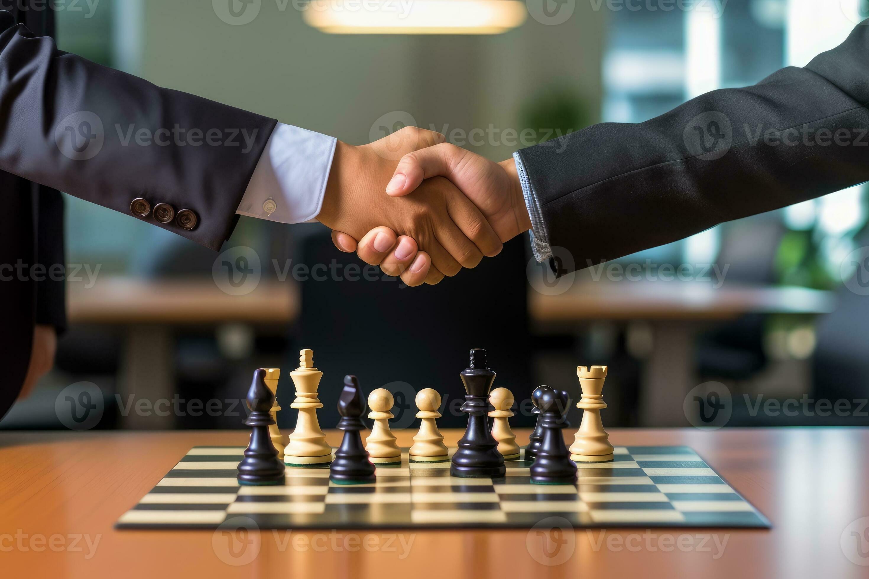 Two men shaking hands over a chess board 27722921 Stock Photo at Vecteezy