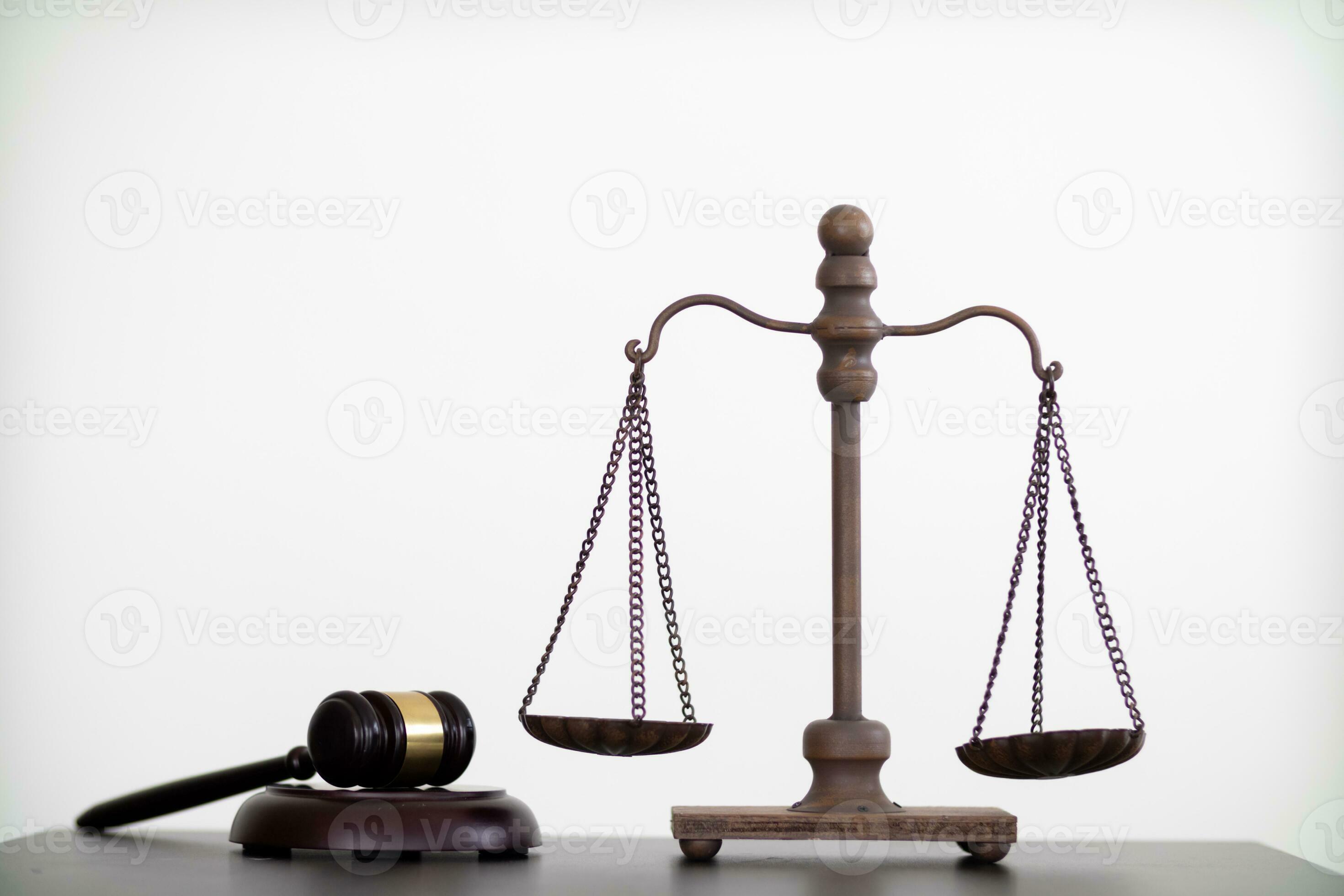 gavel wood and Brass court scales are used to decorate a table in a ...