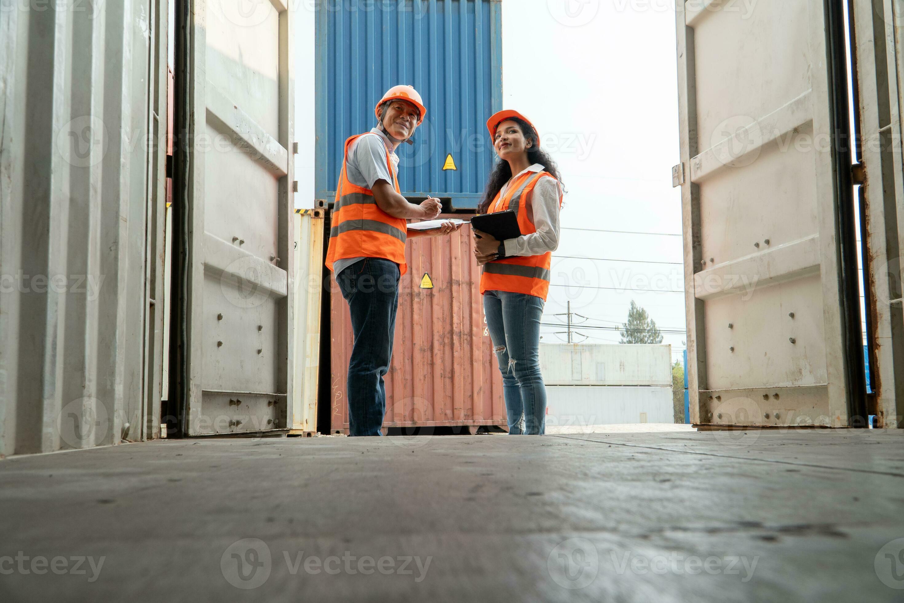 view from inside the container Male and female engineers checking goods 27821946 Stock Photo at ...