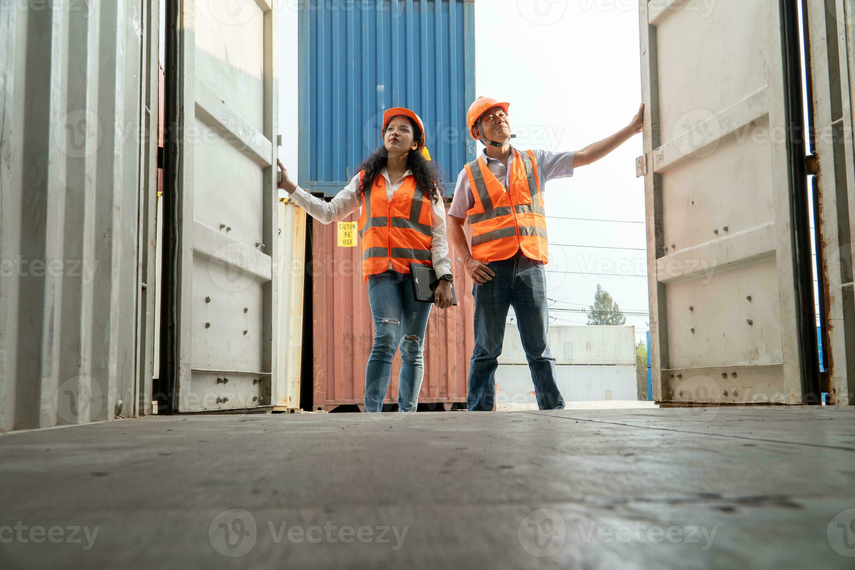 view from inside the container Male and female engineers checking goods 27821954 Stock Photo at ...