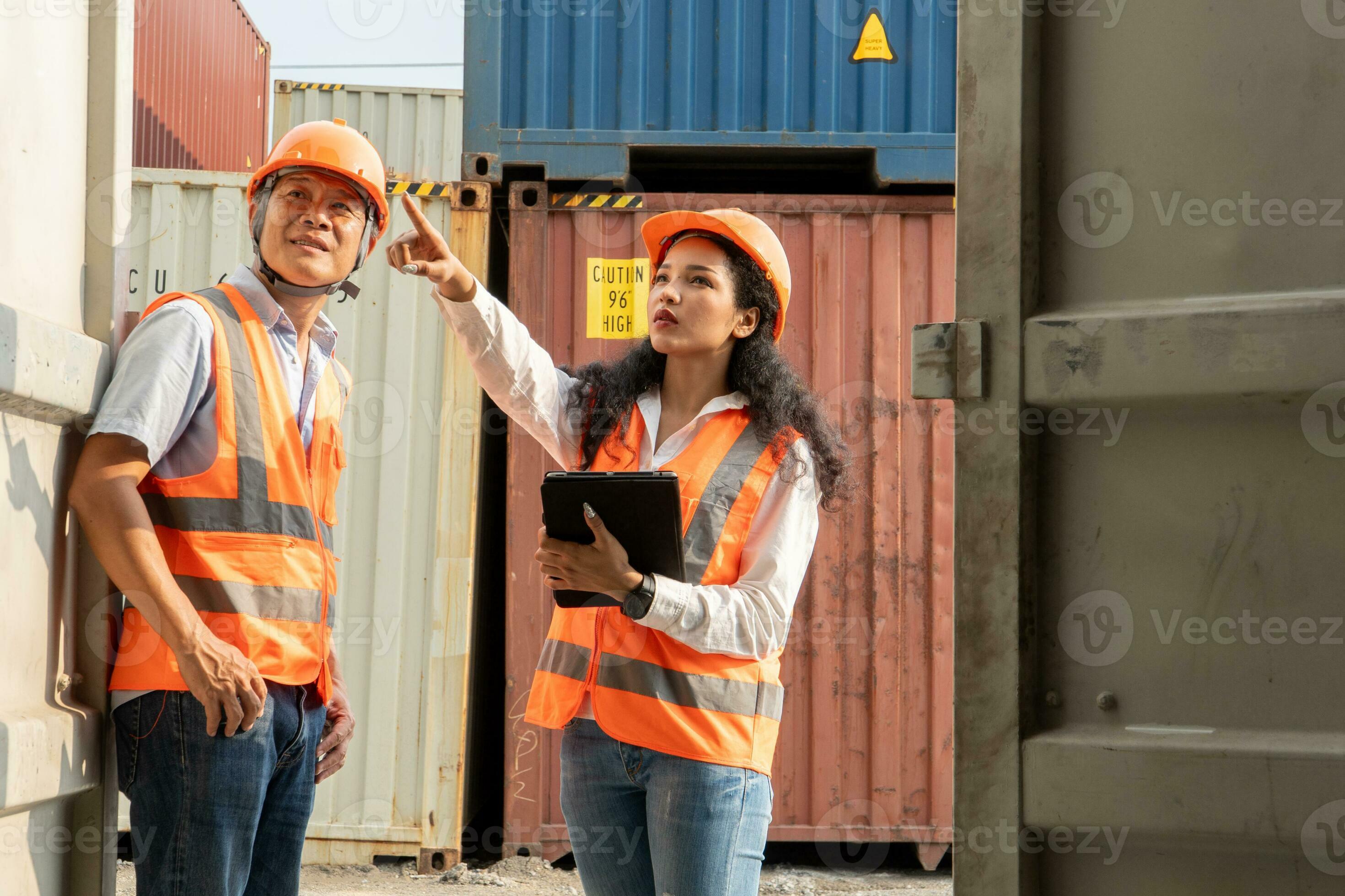 view from inside the container Male and female engineers checking goods 27821972 Stock Photo at ...