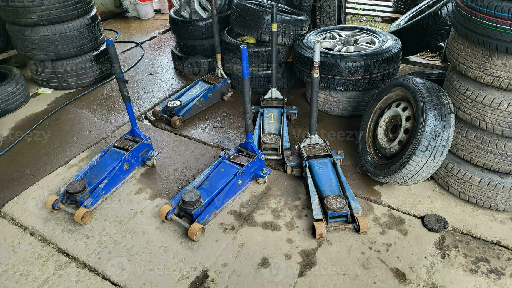 In the auto repair shop repair of wheels and tires 27864259 Stock Photo at Vecteezy