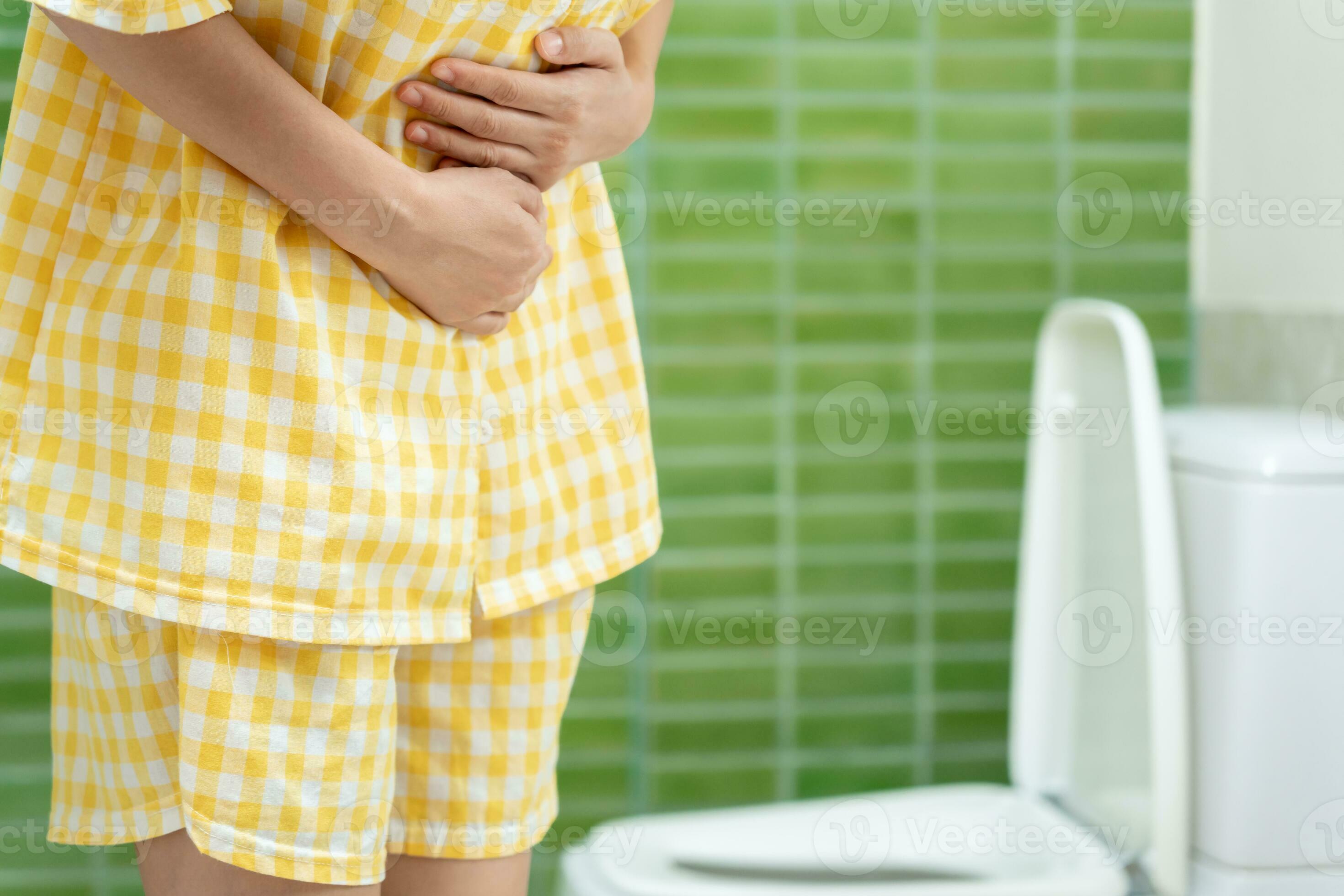 Constipation and diarrhea in bathroom. Hurt woman touch belly stomach ache painful. colon ...