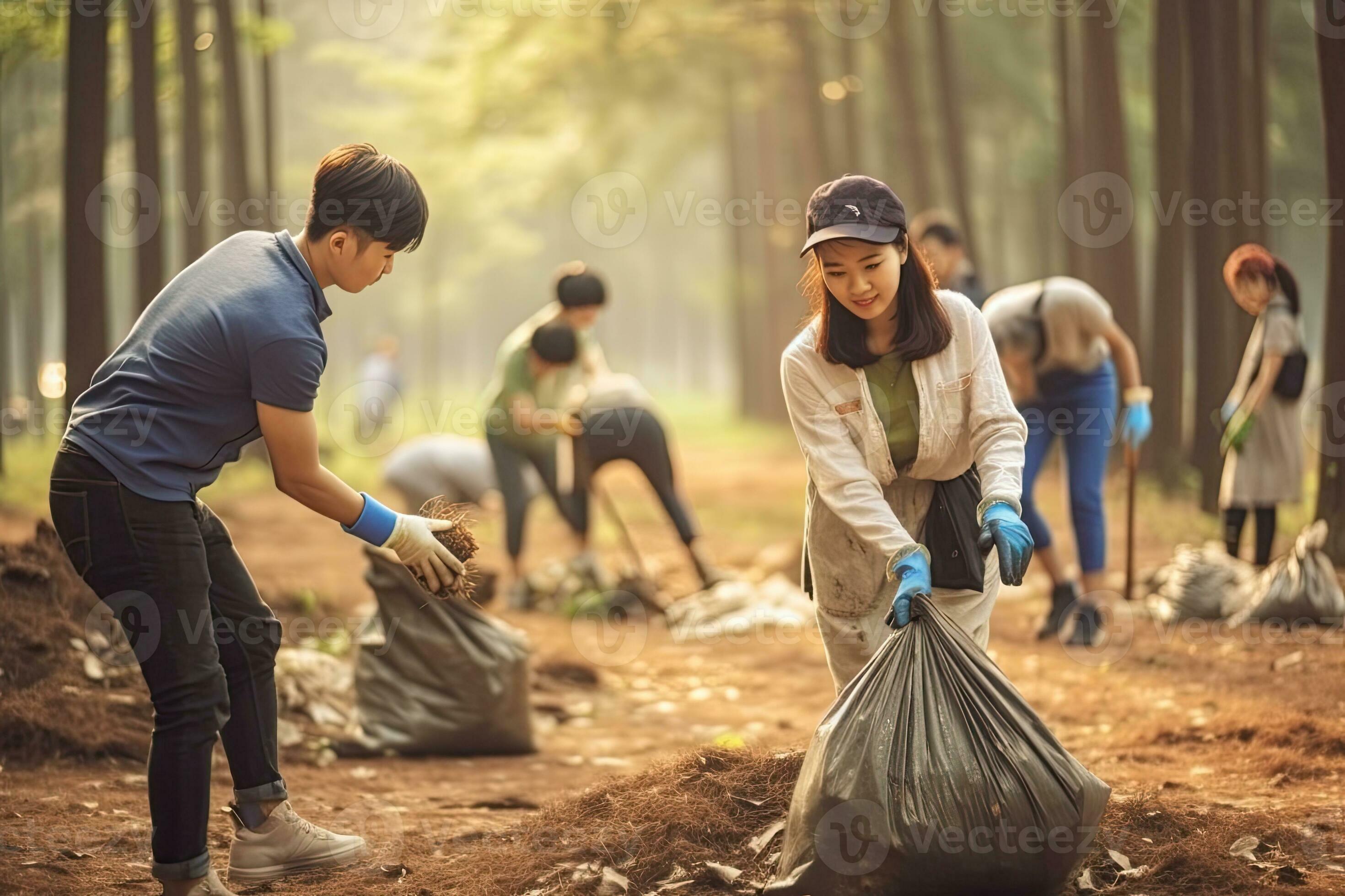 Team of young and diversity volunteer in cleaning up garbage and waste ...
