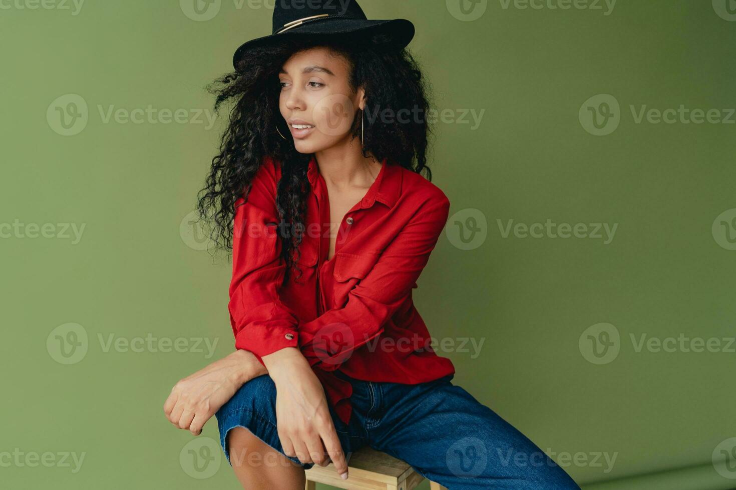 Attractive Black African American Woman In Stylish Outfit On Green
