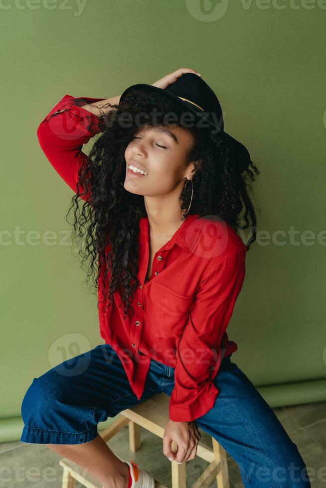 Attractive Black African American Woman In Stylish Outfit On Green