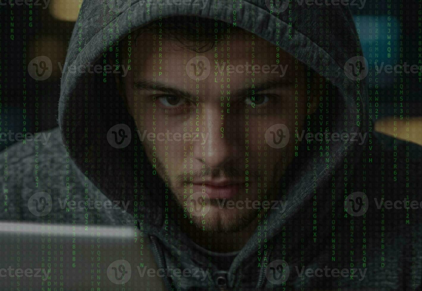 Hacker In A Hoodie, Working On Laptop, And Curtain Of Green Lines Of ...
