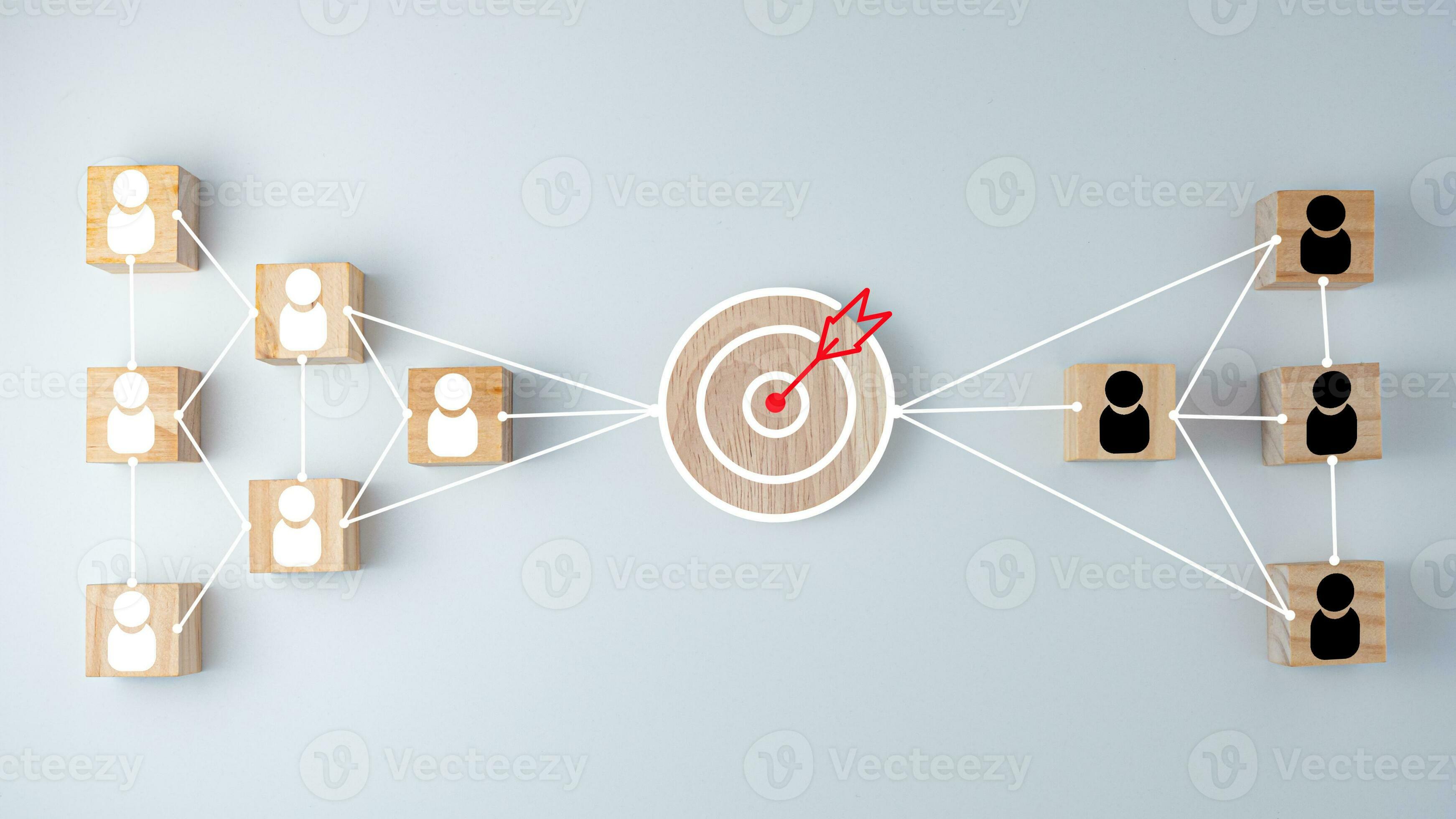 wooden block which prints a target icon connection linkage with human icon on white background ...