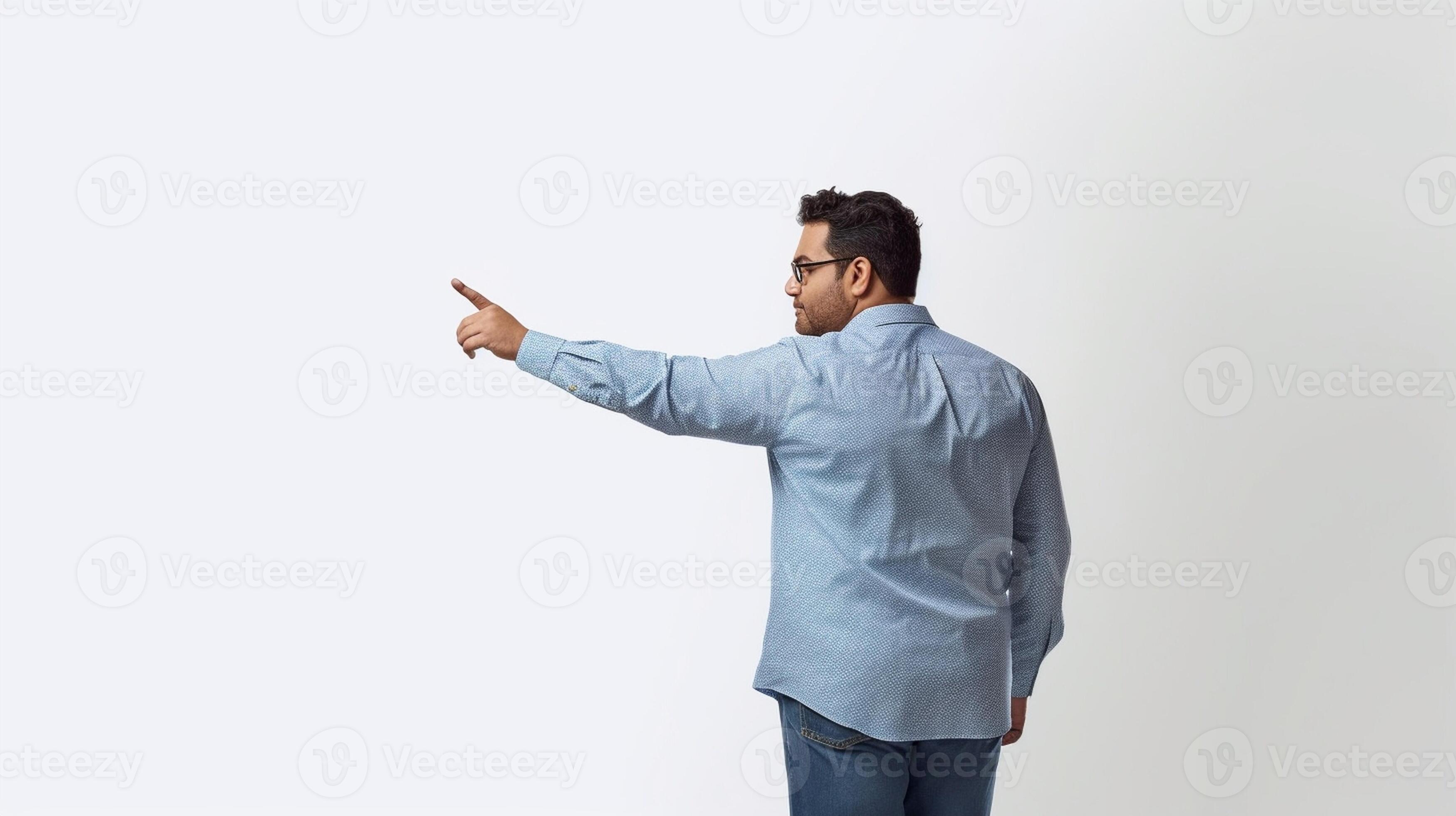 Businessman pointing copy space Handsome young man in shirt looking at ...