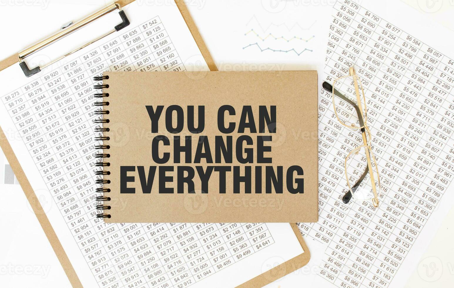 Craft colour notepad with text YOU CAN CHANGE EVERYTHING. Notepad with eyeglasses and text ...