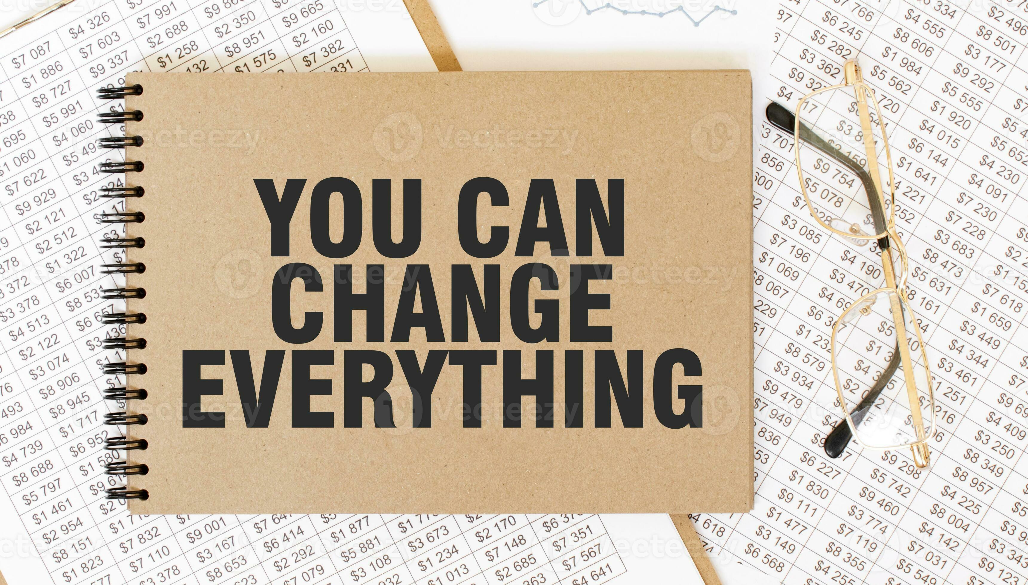 Craft colour notepad with text YOU CAN CHANGE EVERYTHING. Notepad with eyeglasses and text ...