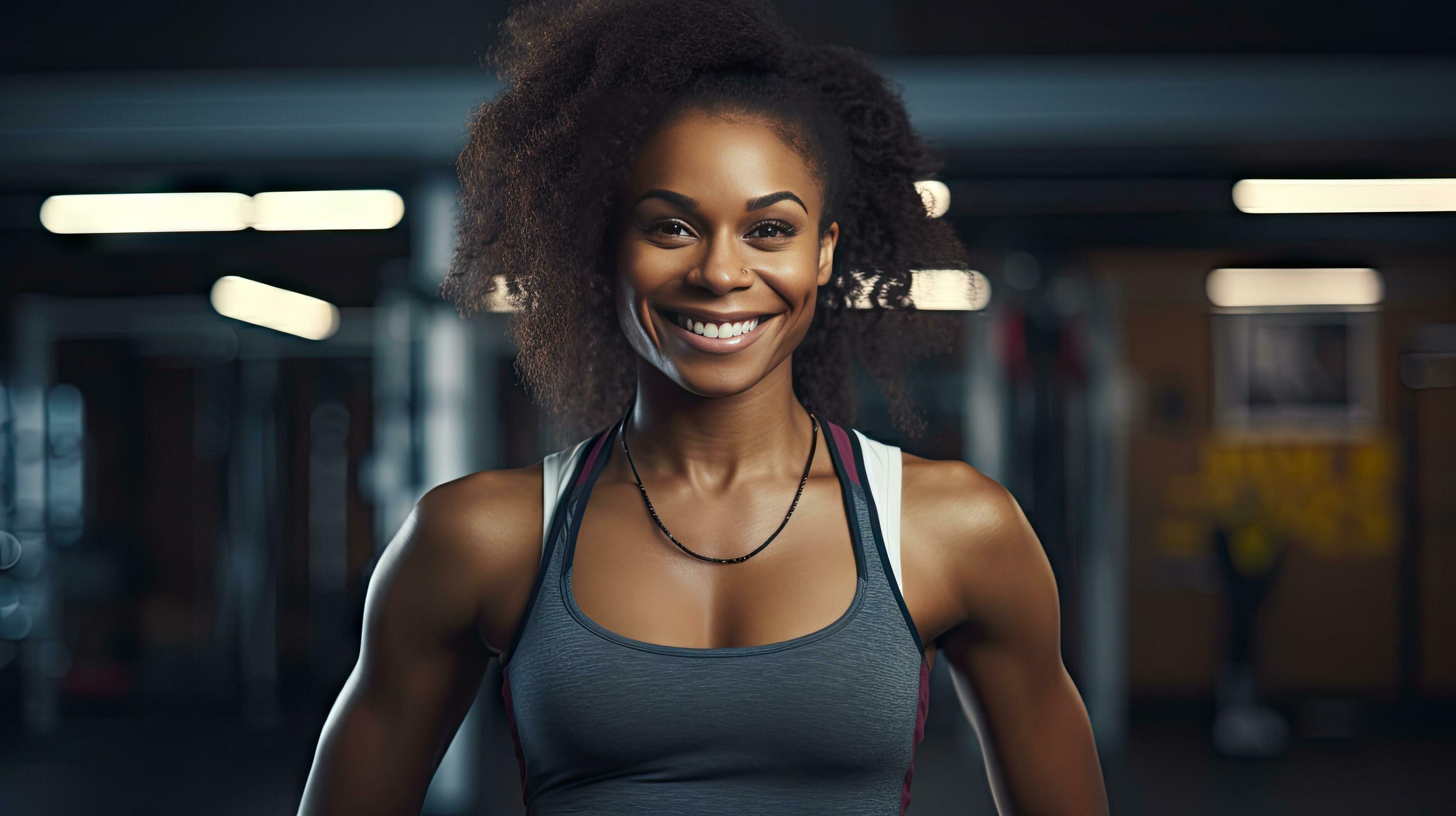 Black woman fitness, beautiful Afro-American woman with curly hair in the gym African fitness ...