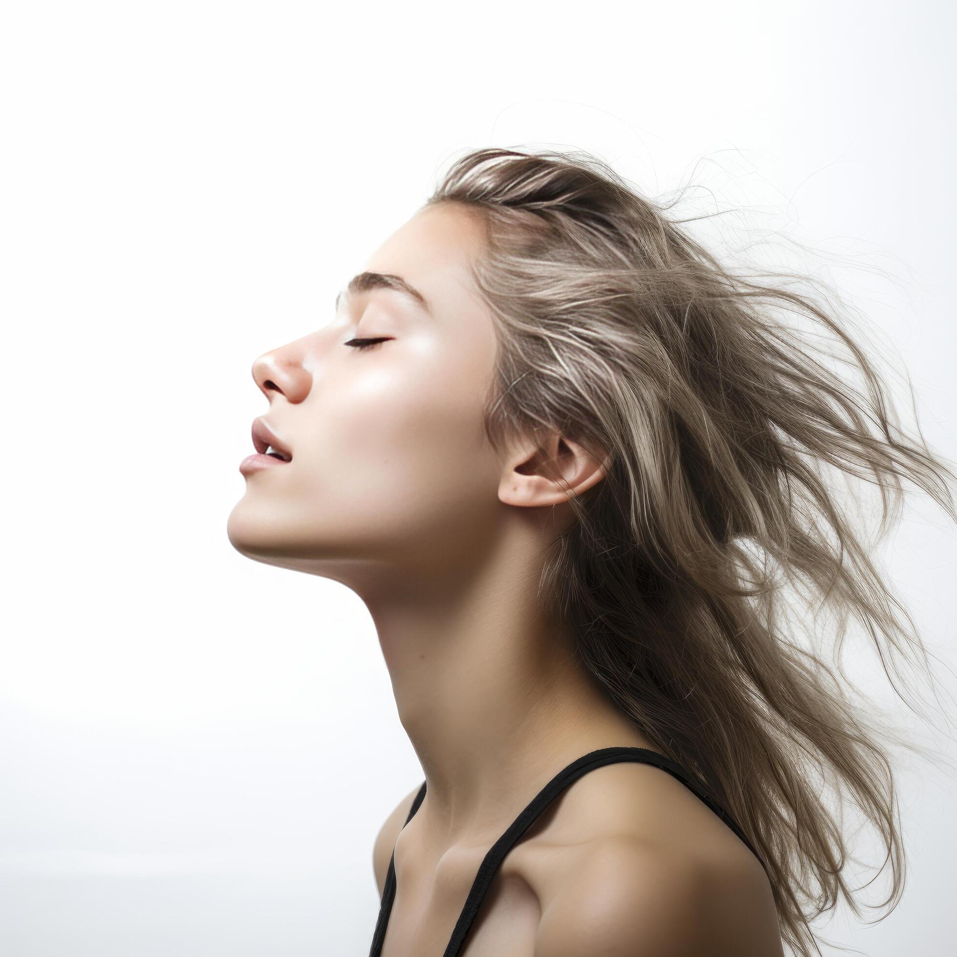 left side view of girl face with blowing hairs on white background ...