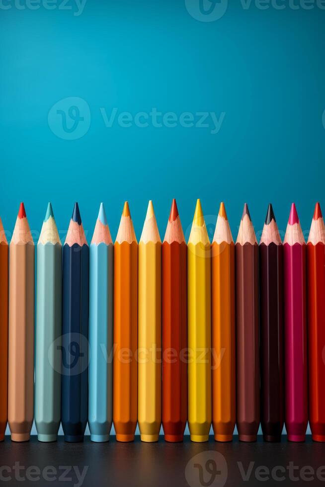 A row of colored pencils lined up against a blue background. AI generative 29706399 Stock Photo ...