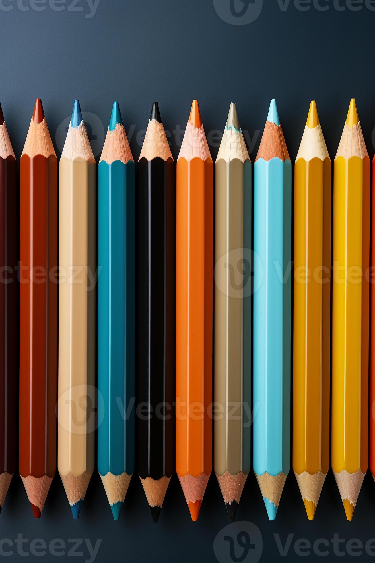 A row of colored pencils lined up against a blue background. AI generative 29706400 Stock Photo ...