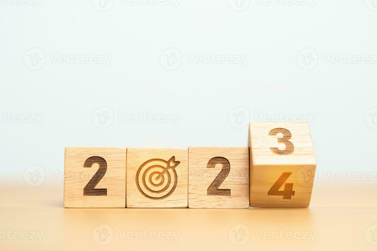 2023 year change to 2024 year block with dartboard icon. Goal, Target, Resolution, strategy ...