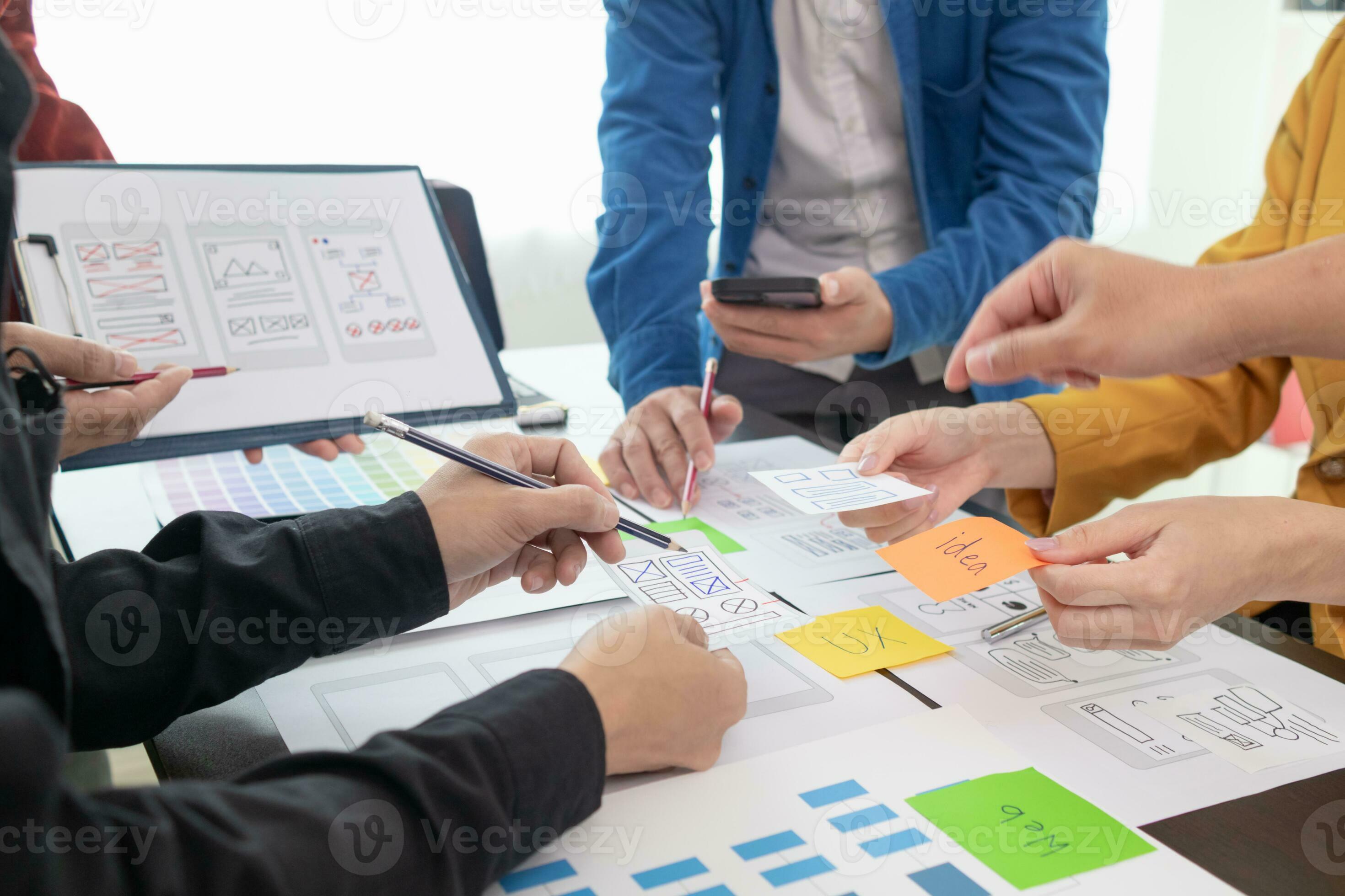 team of UI UX web designer are working together to develop mobile ...