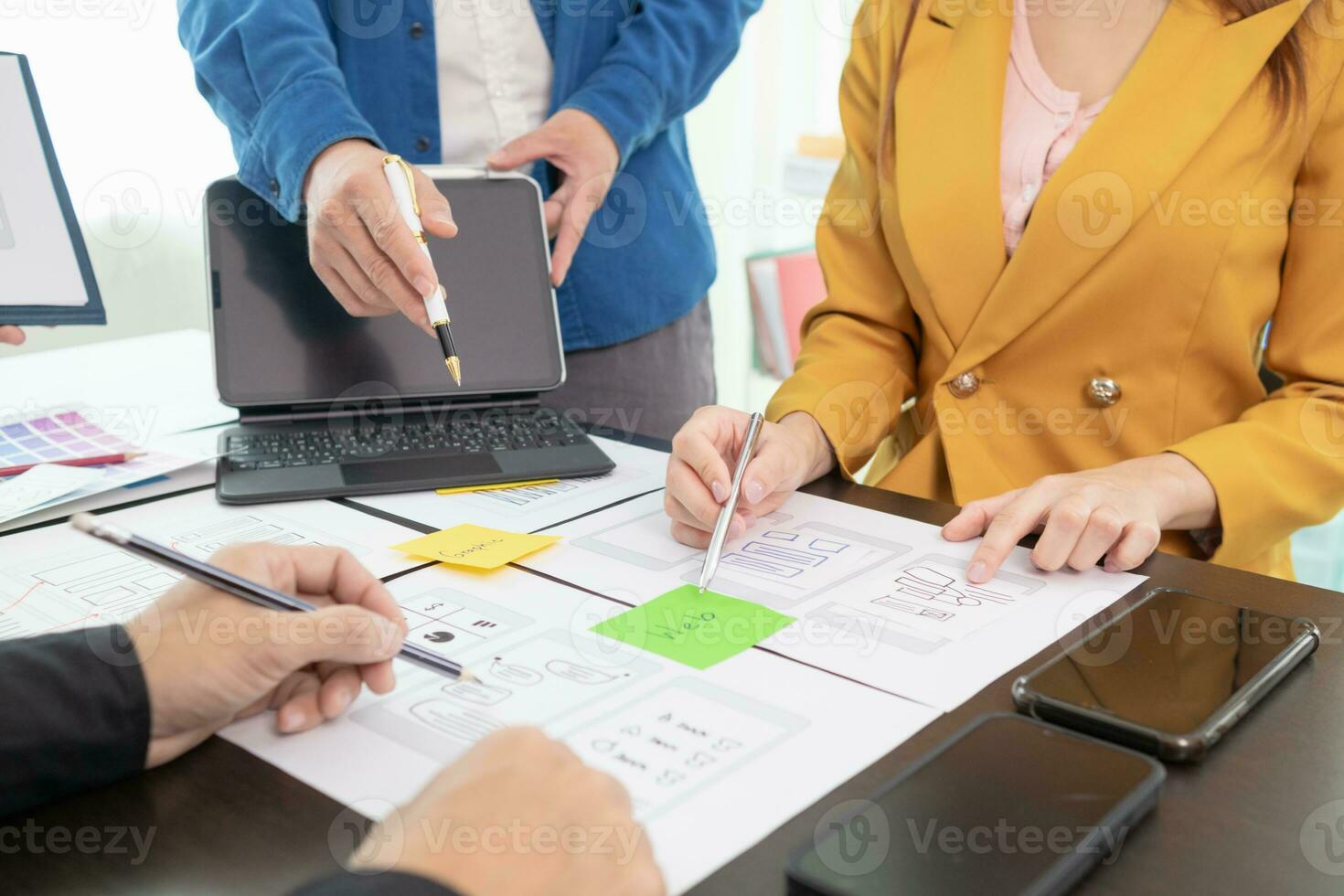 team of UI UX web designer are working together to develop mobile ...