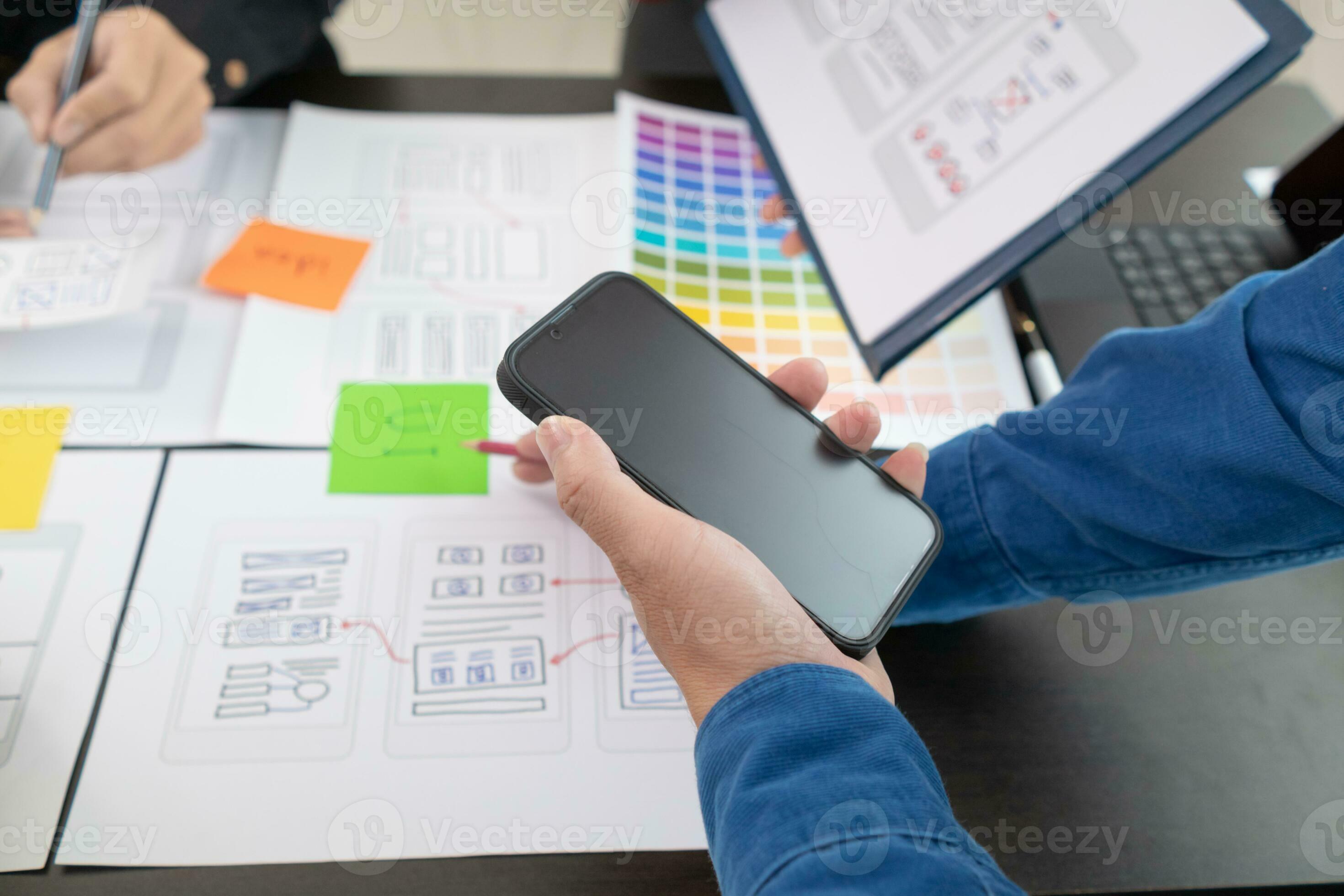 team of UI UX web designer are working together to develop mobile ...