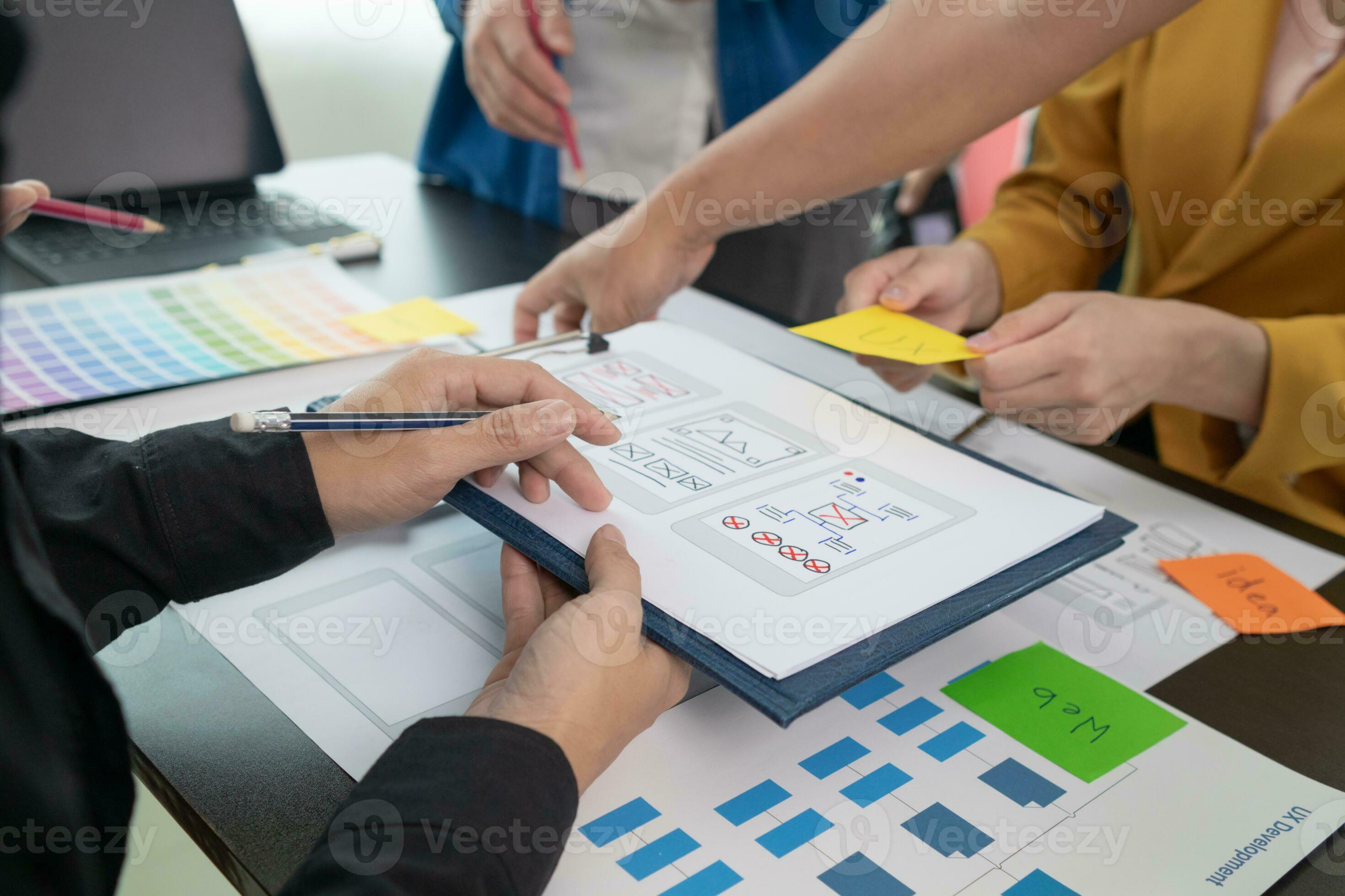 team of UI UX web designer are working together to develop mobile ...