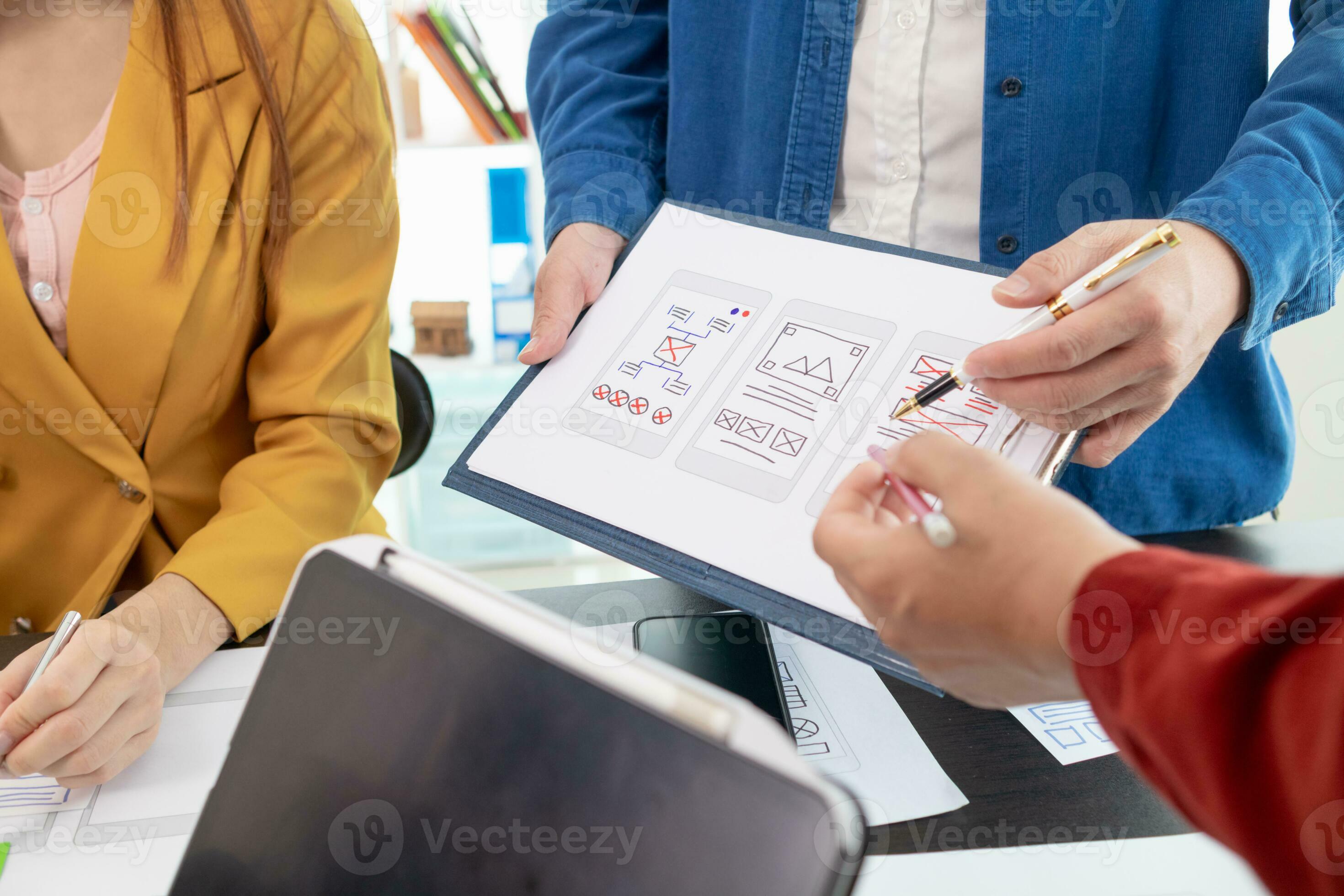 team of UI UX web designer are working together to develop mobile ...