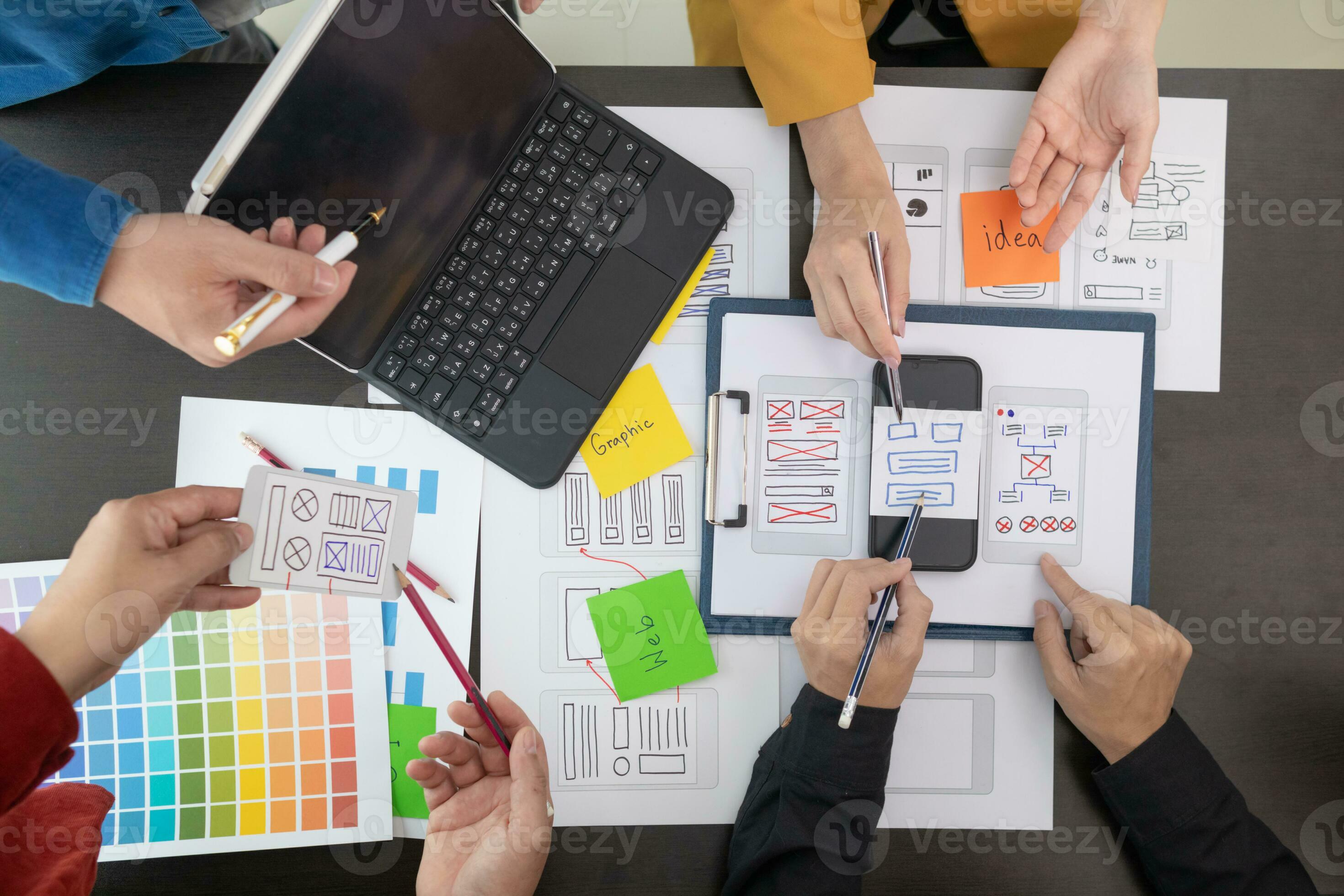 team of UI UX web designer are working together to develop mobile ...