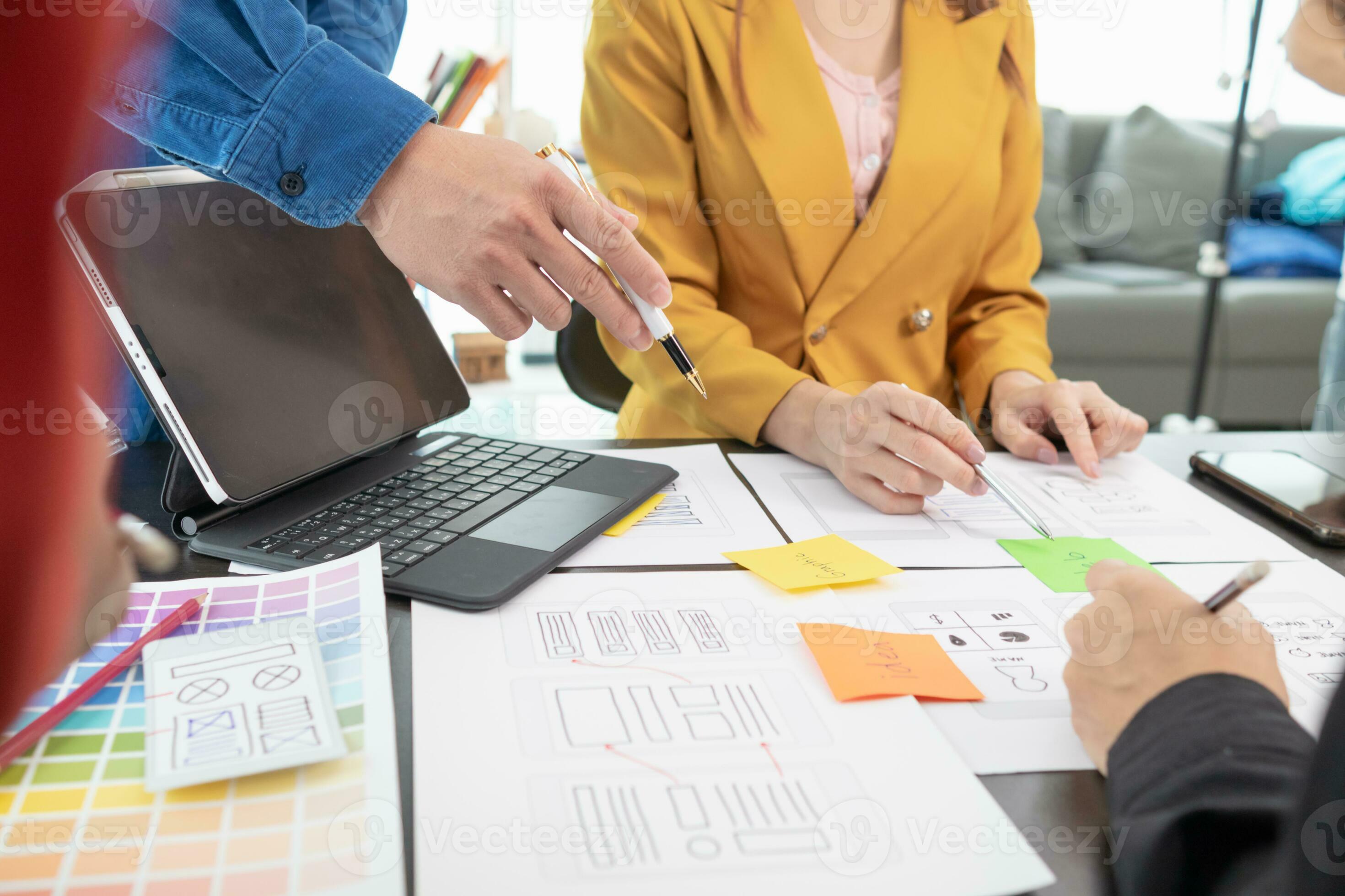 team of UI UX web designer are working together to develop mobile ...