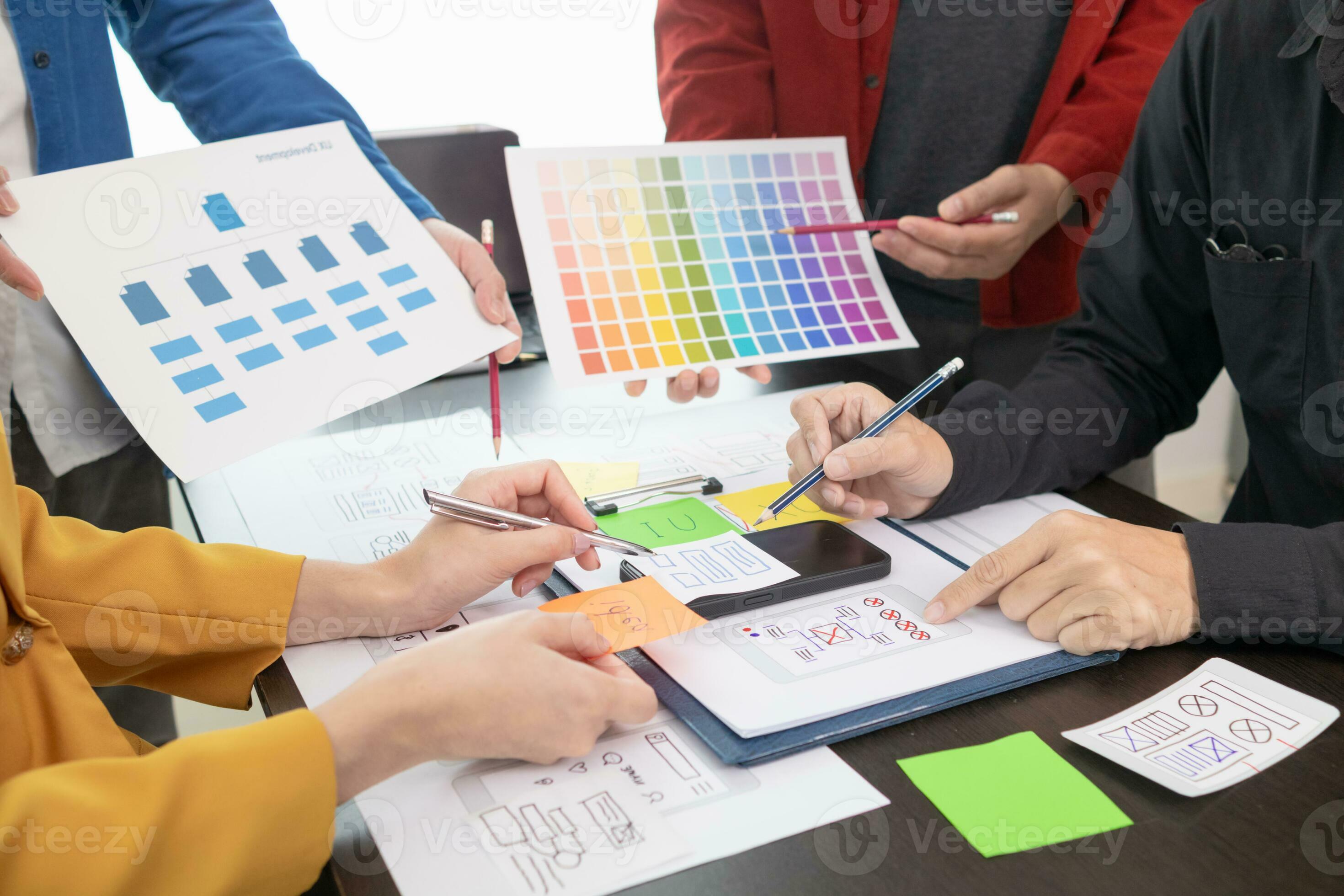 team of UI UX web designer are working together to develop mobile ...