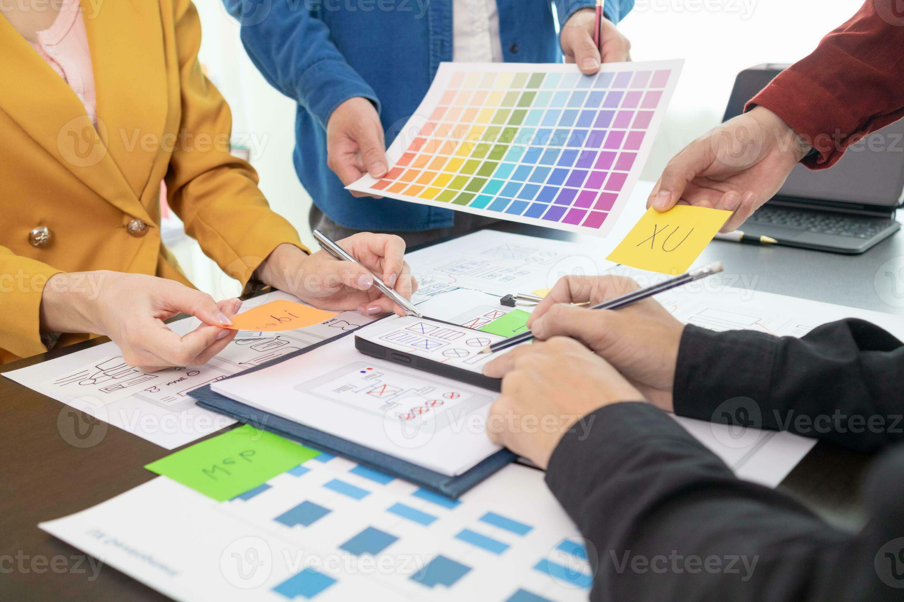 team of UI UX web designer are working together to develop mobile ...