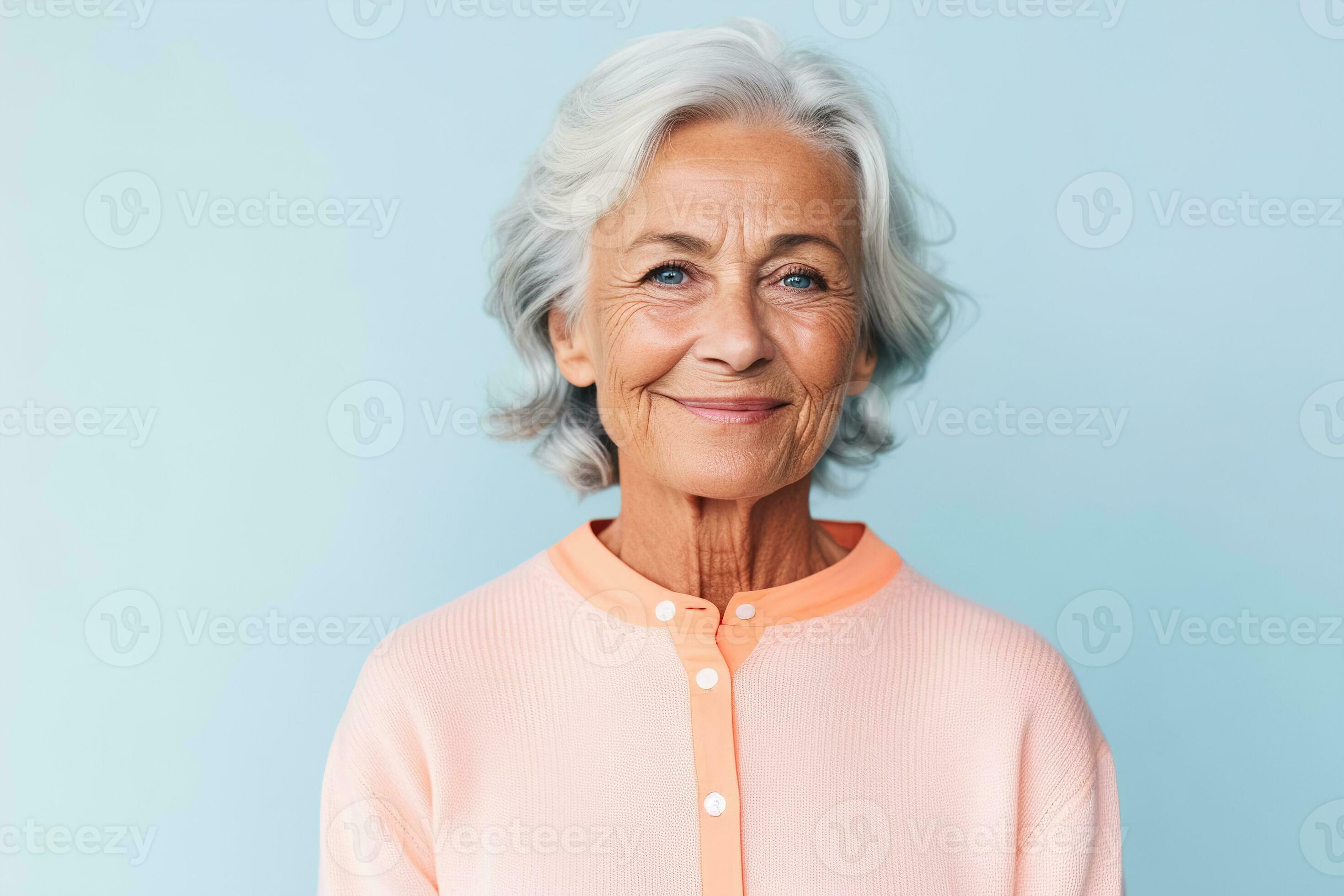 Beautiful elderly woman with gray hair smiling at the camera. Happy old age concept, AI ...