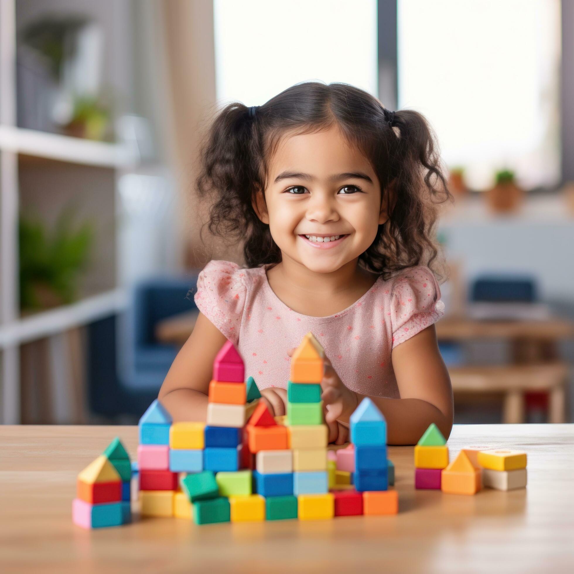 A young child using blocks to learn basic counting and math skills ...