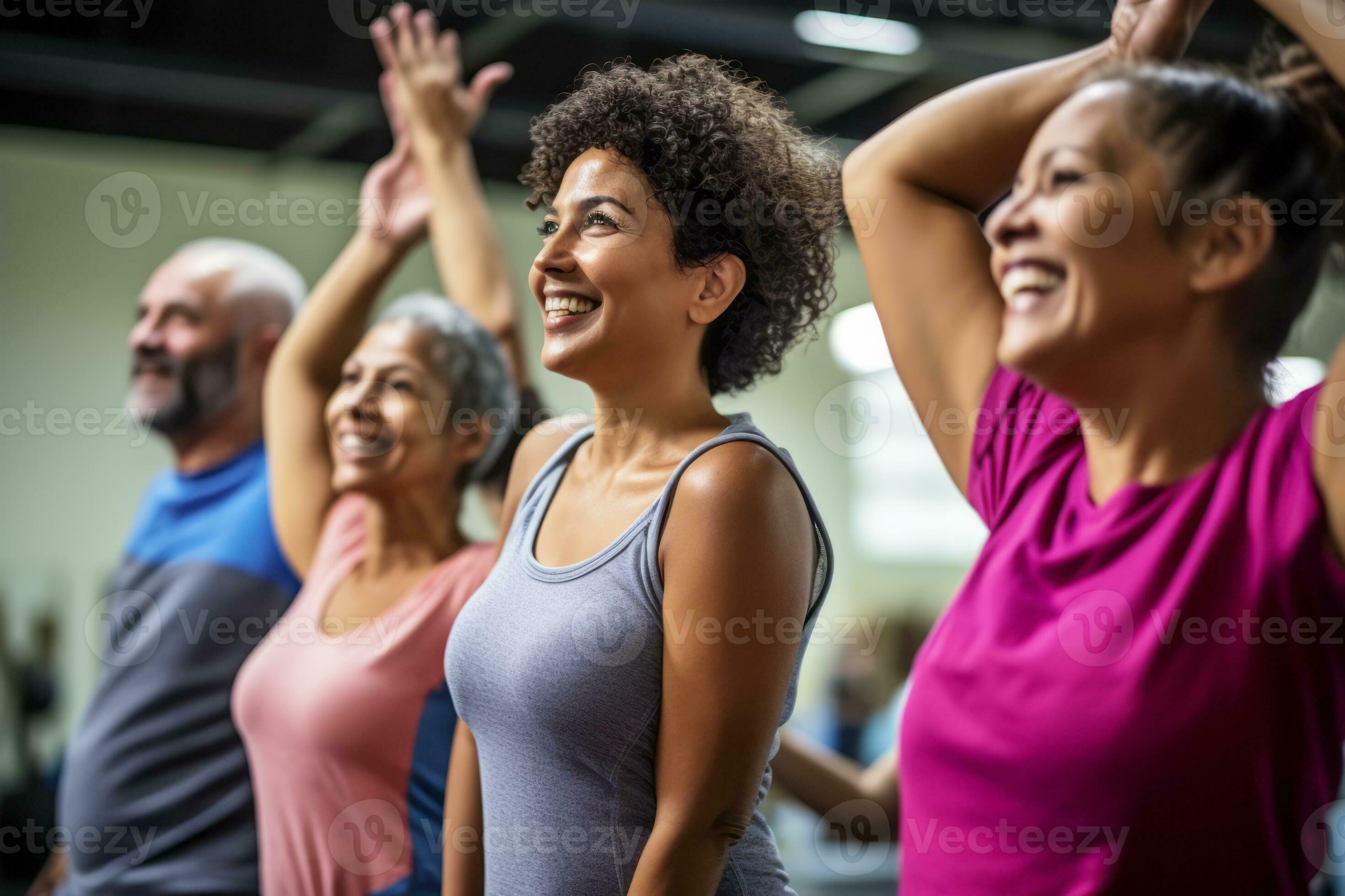 A diverse group of people engaging in various fitness activities ...